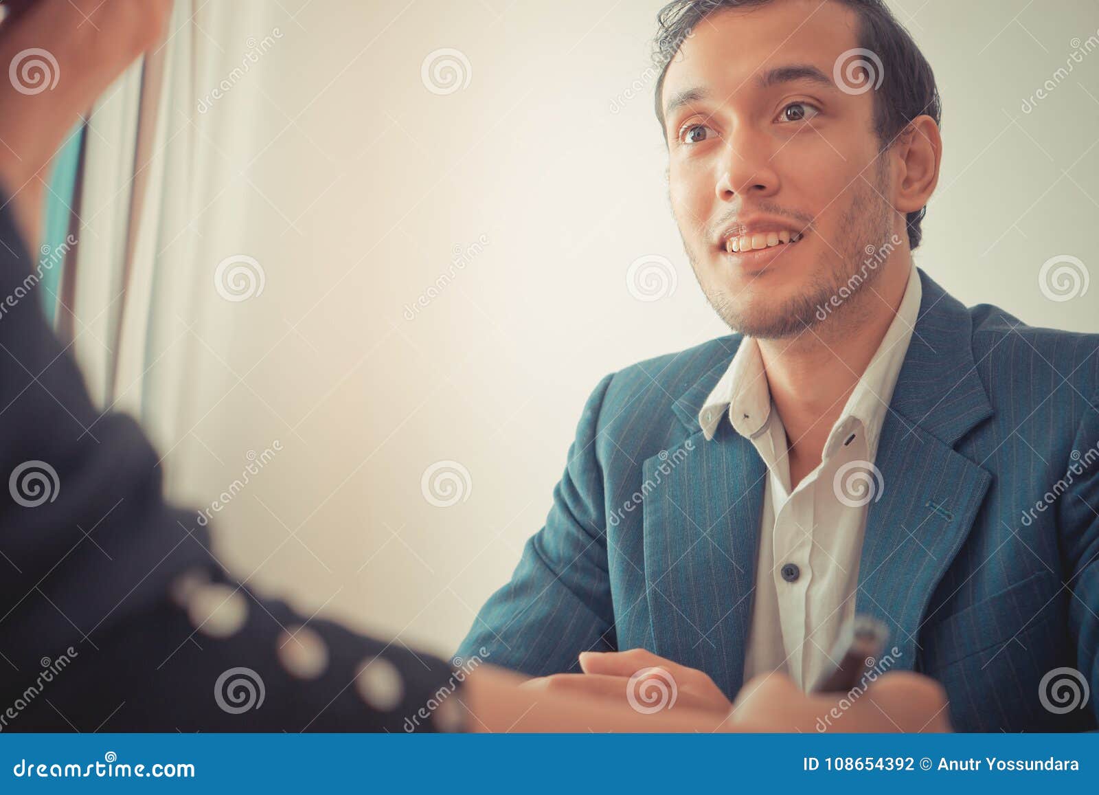 Business Man Looking Interested while Dealing with Partner Stock Photo ... Business Man Looking Interested while Dealing with Partner Stock Photo ...
