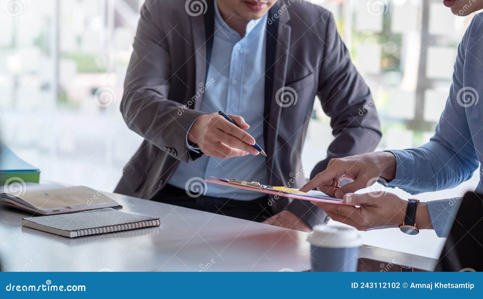 Business Man Meeting Sharing Work Ideas Pointing To Graph in the Office ...