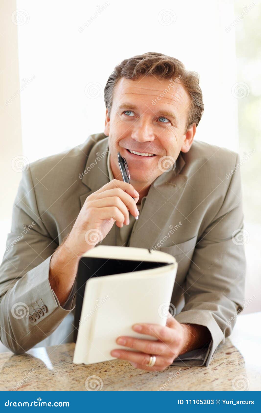 Business Man with a Notebook and Pen Stock Image - Image of holding ...