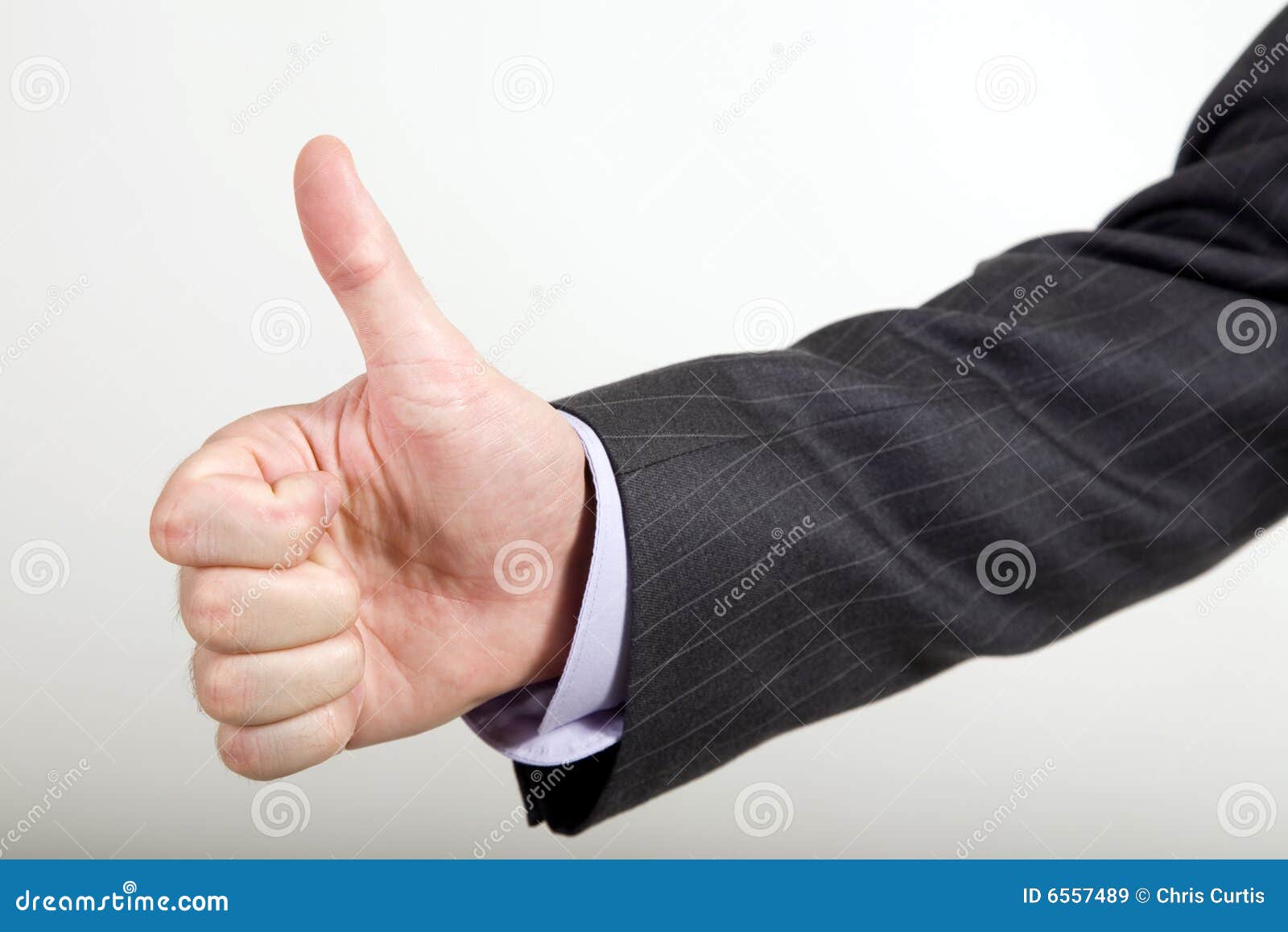 Business Man Offers Thumbs-Up Stock Image - Image of deal, suit: 6557489