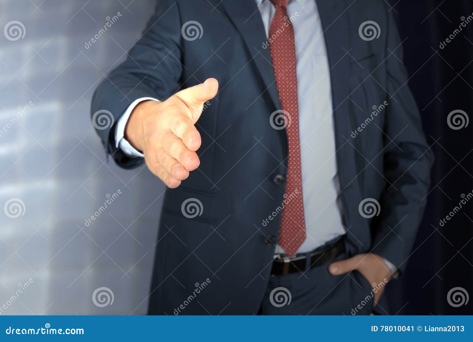 A Business Man with an Open Hand Extended To Handshake Stock Image ...