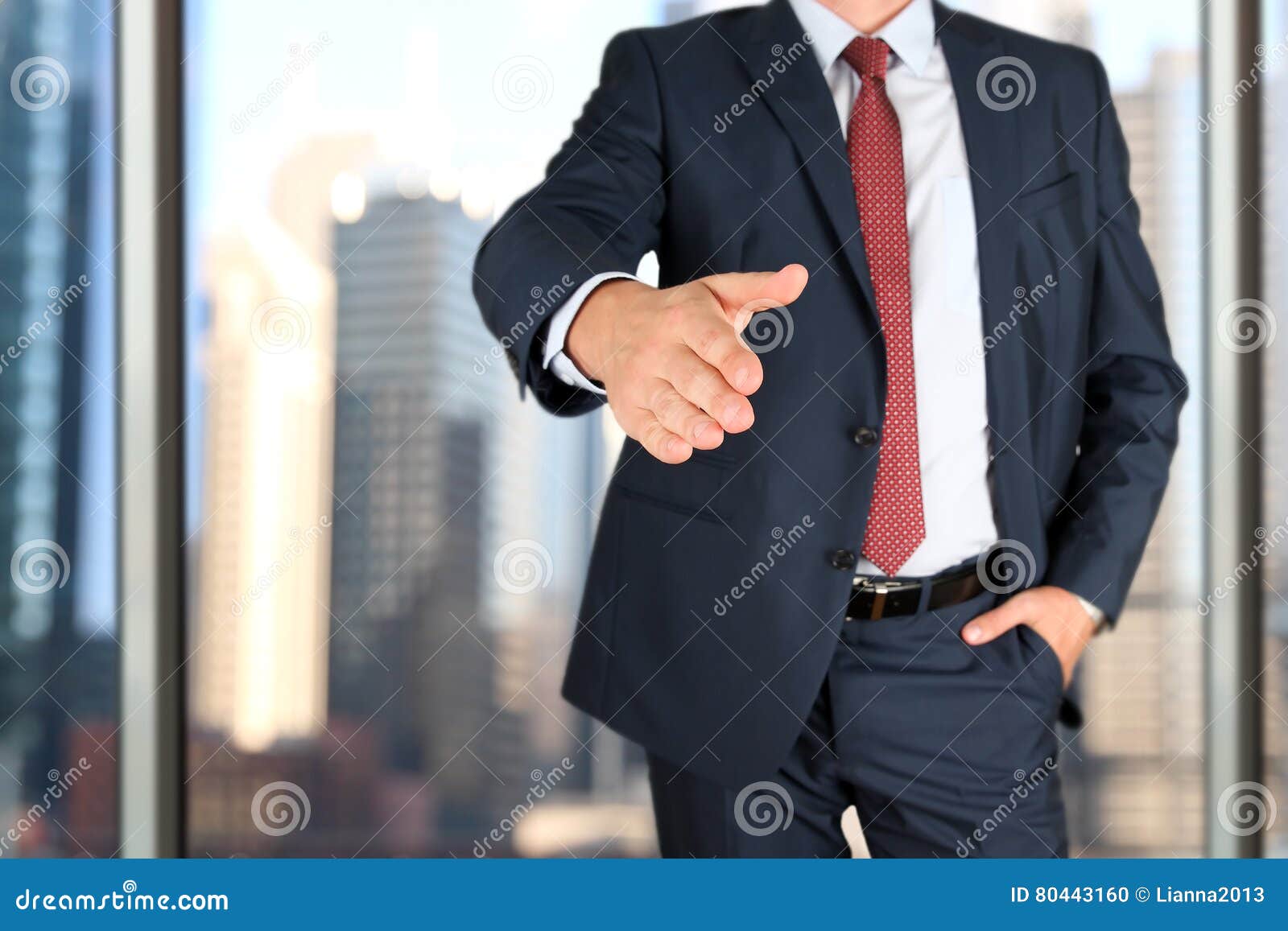 A Business Man with an Open Hand Extended To Handshake Stock Photo ...