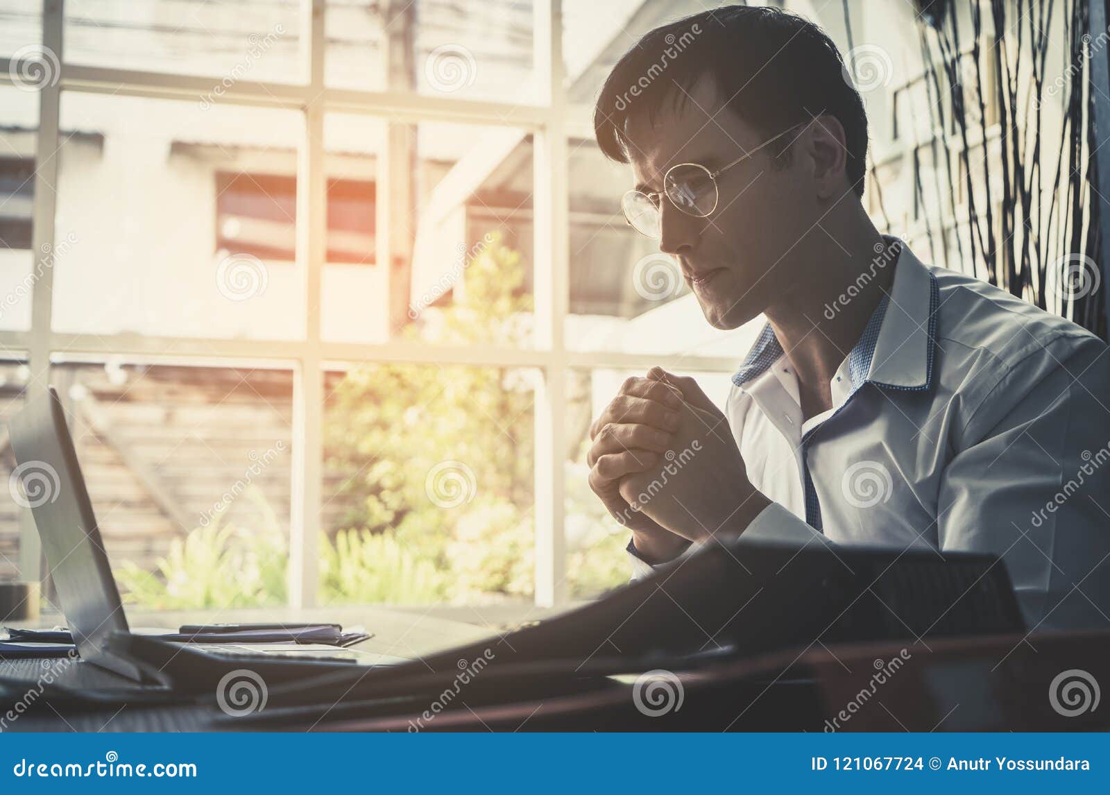 Business Man Praying for Business on Computer Stock Photo - Image of ...