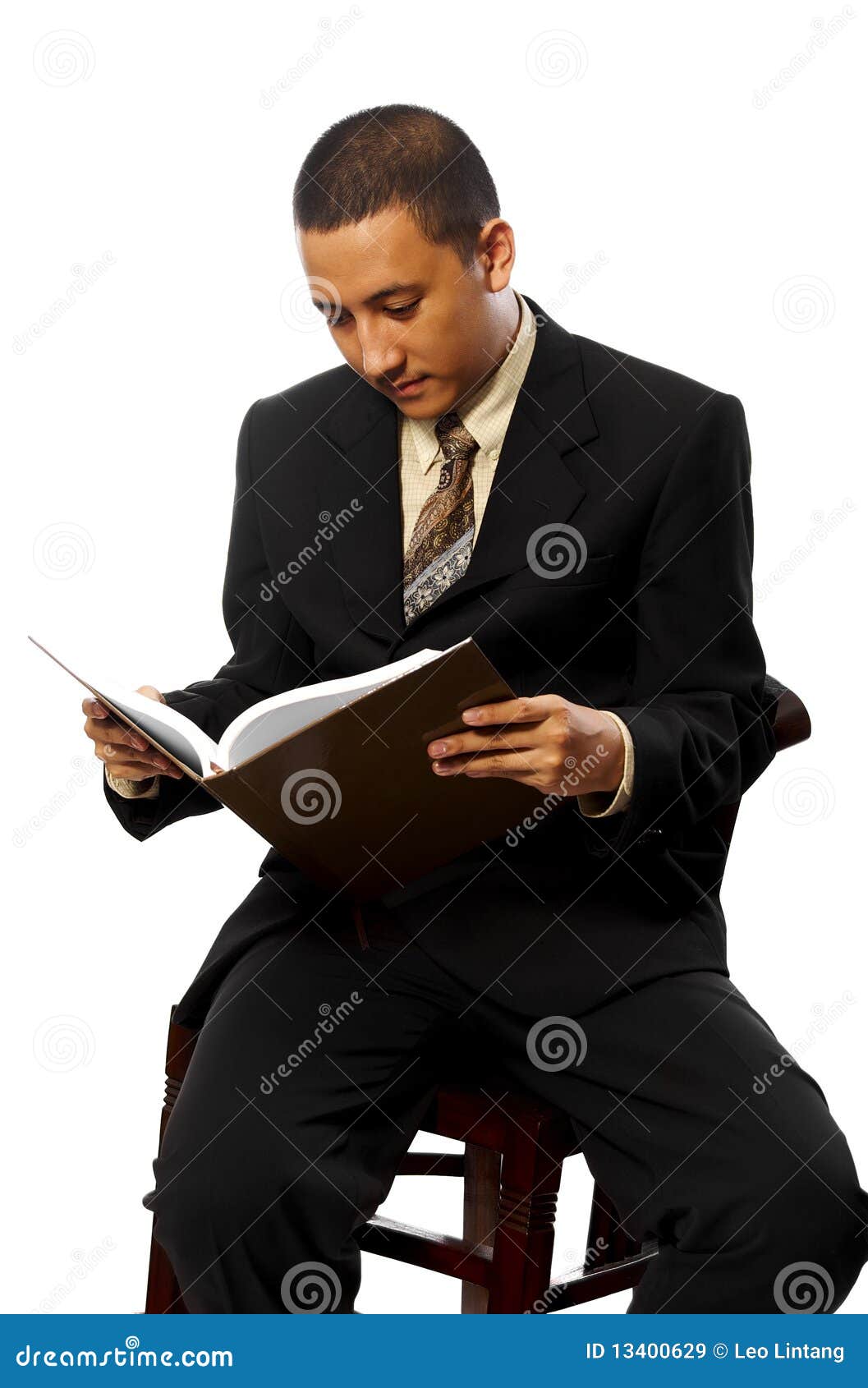 Business Man Reading Book stock image. Image of suit - 13400629
