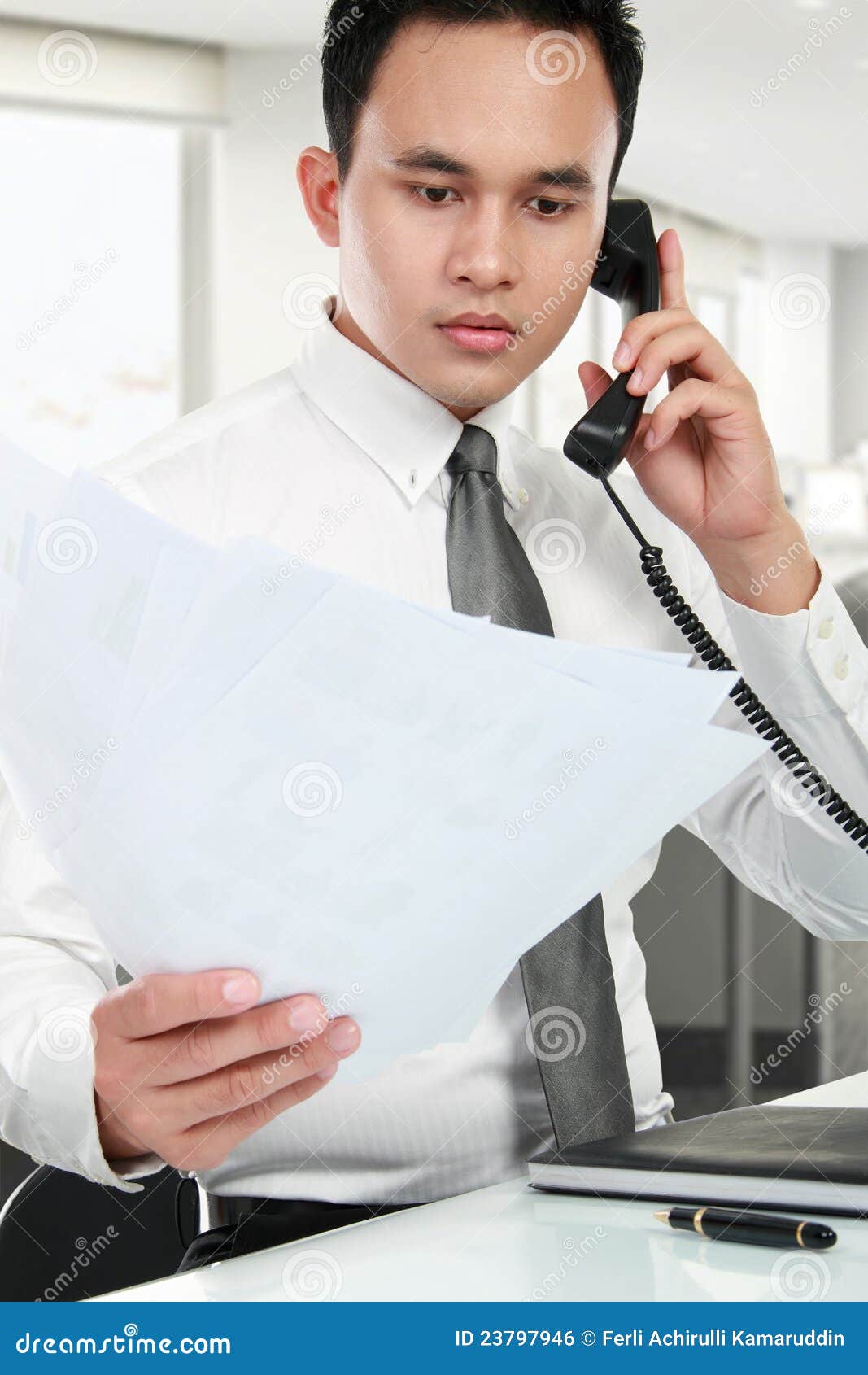 Business Man Reading a Report Stock Photo - Image of businessman, male ...