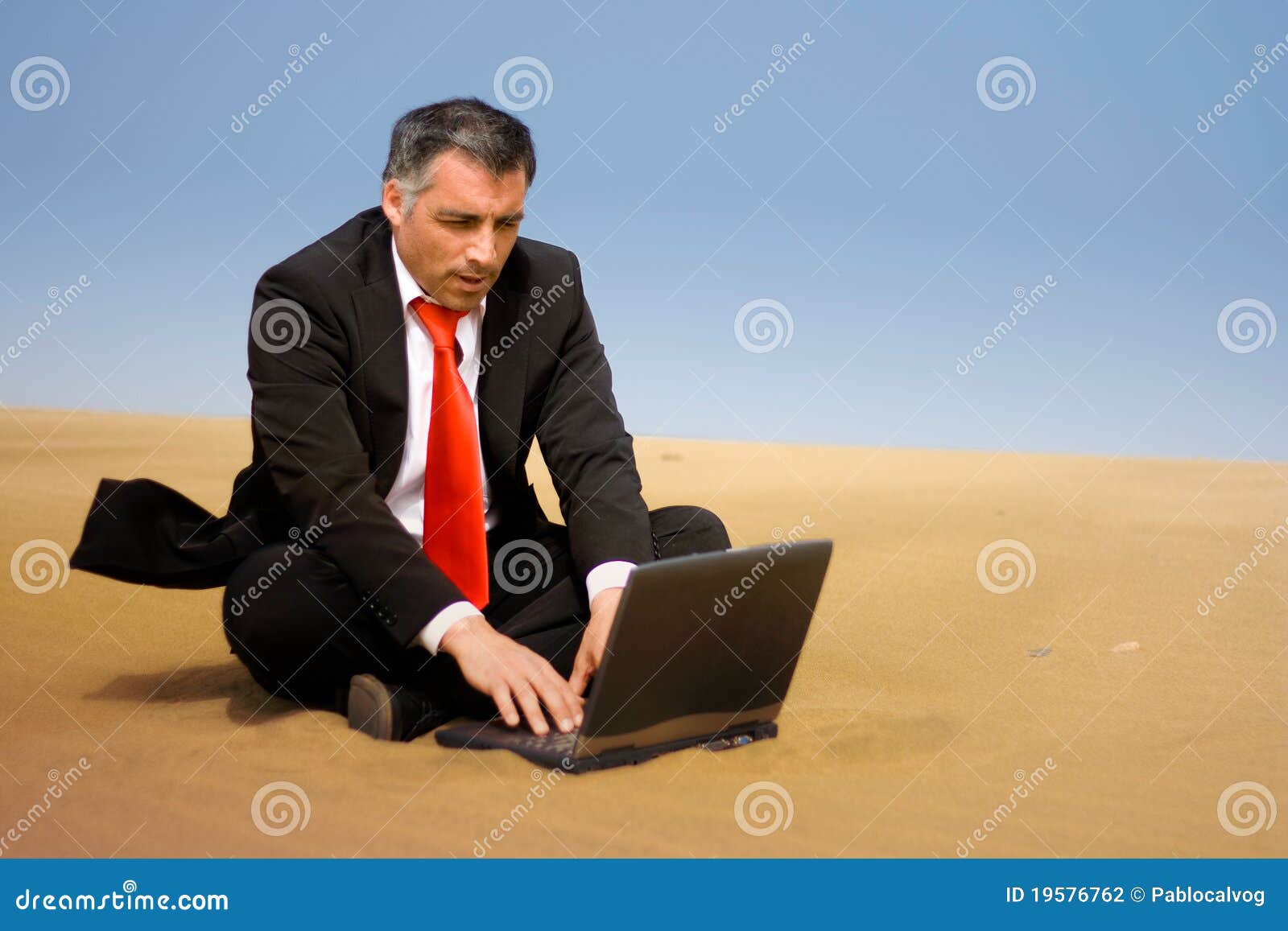 A Business Man Relaxing and Sit Down on the Sand Stock Photo - Image of ...