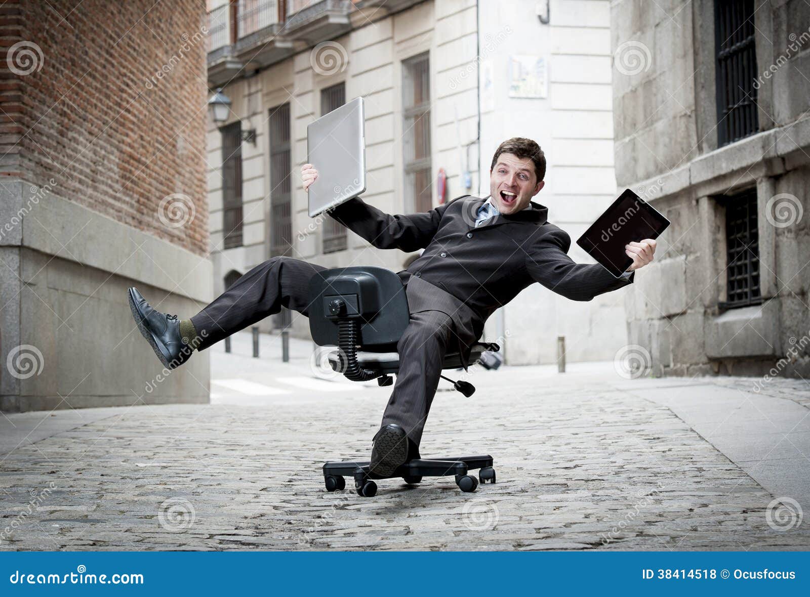 Business Man Rolling Downhill on Chair with Computer and Tablet Stock ...