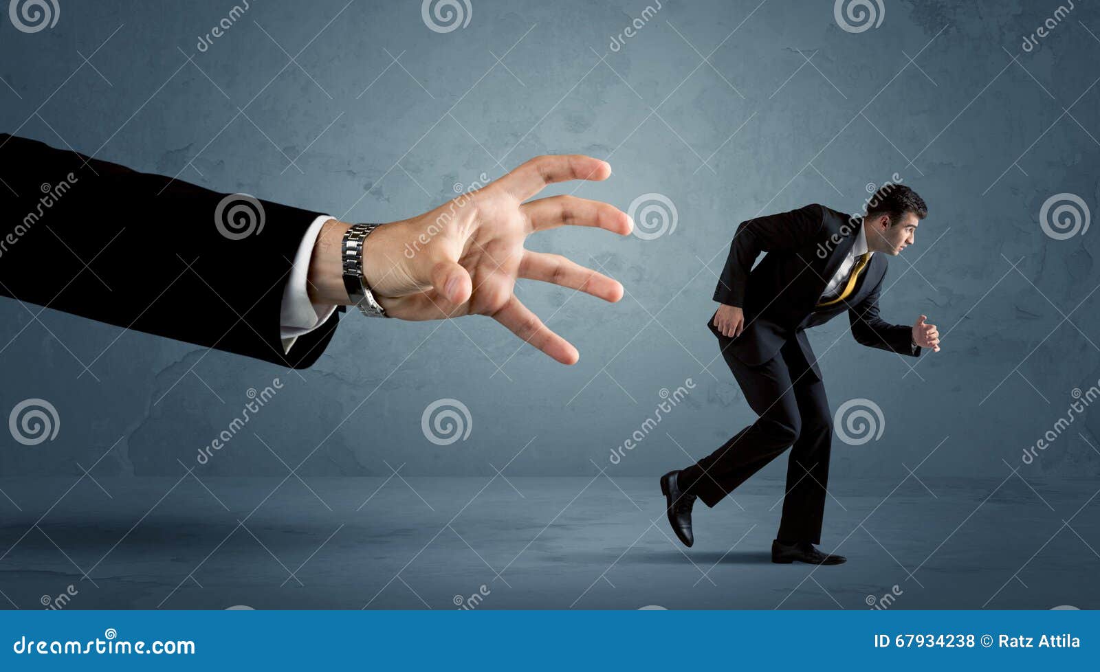 Business Man Running Away from a Huge Hand Concept Stock Photo - Image ...