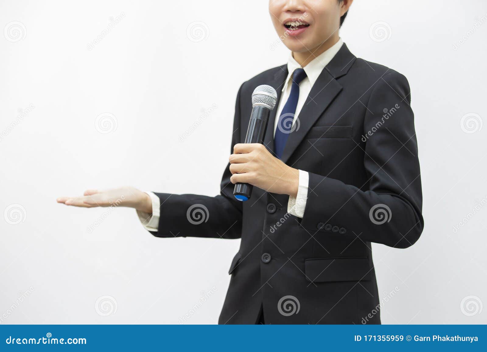 Business Man Smiling, Speaking Holding Microphone at Conference Stock ... Business Man Smiling, Speaking Holding Microphone at Conference Stock ...
