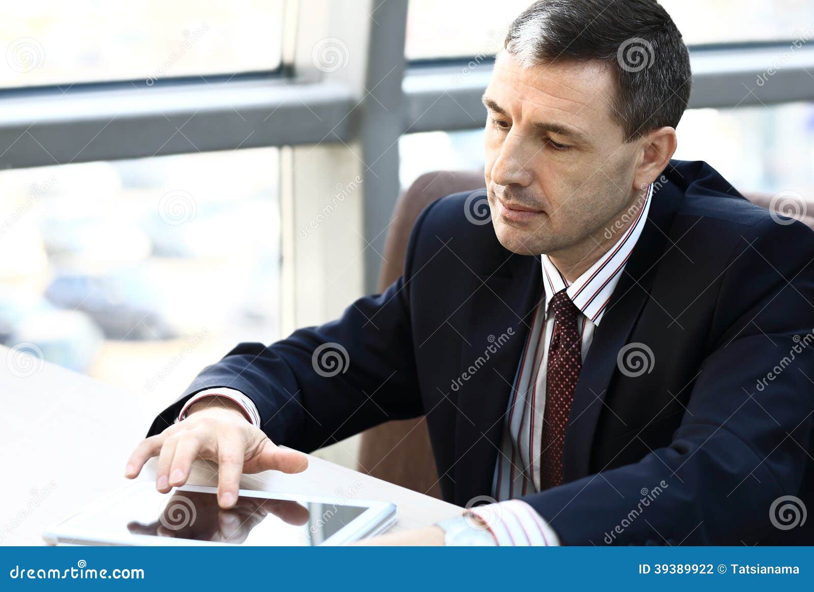 Business Man Smiling while Working on Tablet Stock Photo - Image of ...