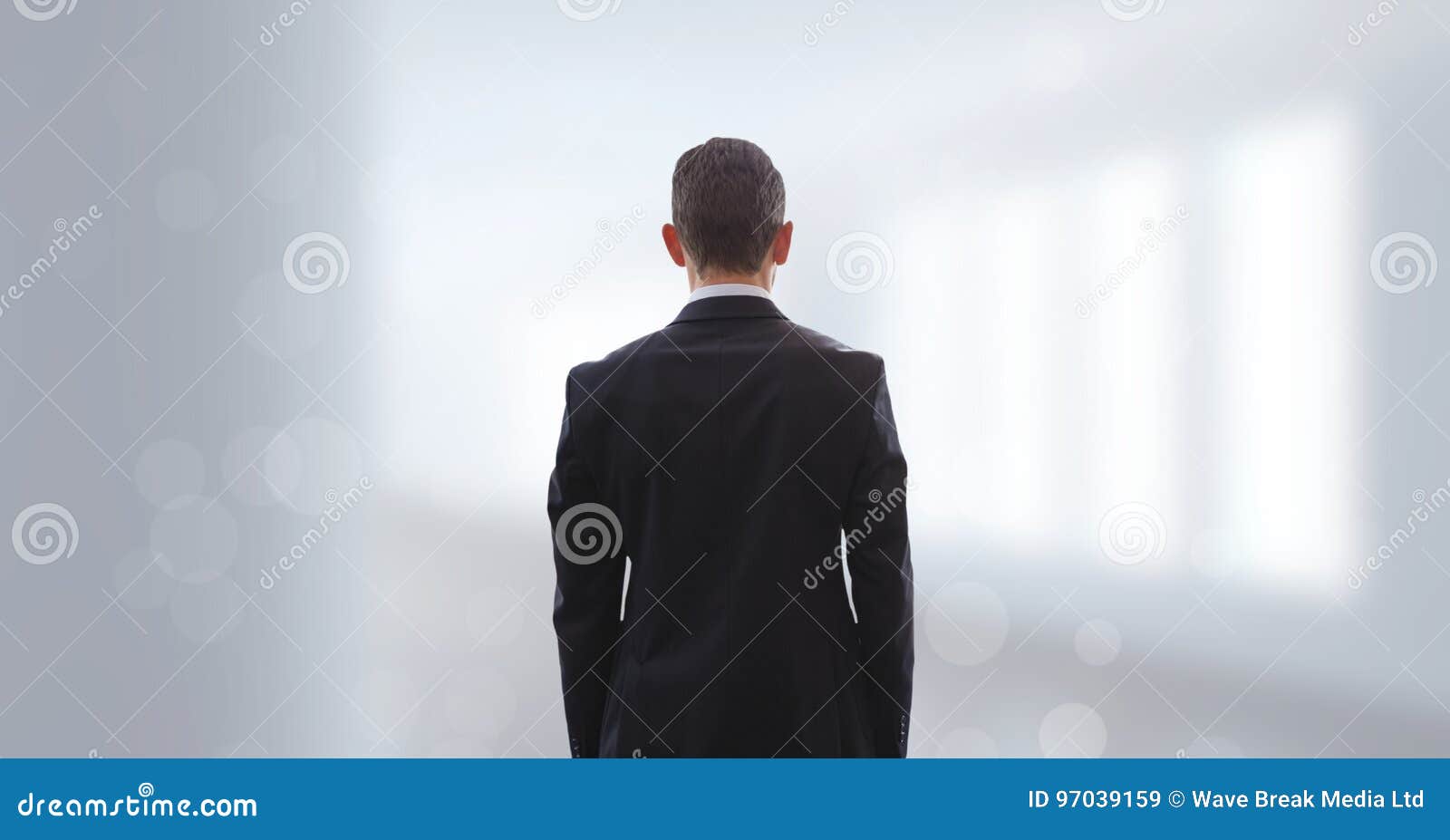 Business Man Standing Against White Blurred Background Stock Image ...