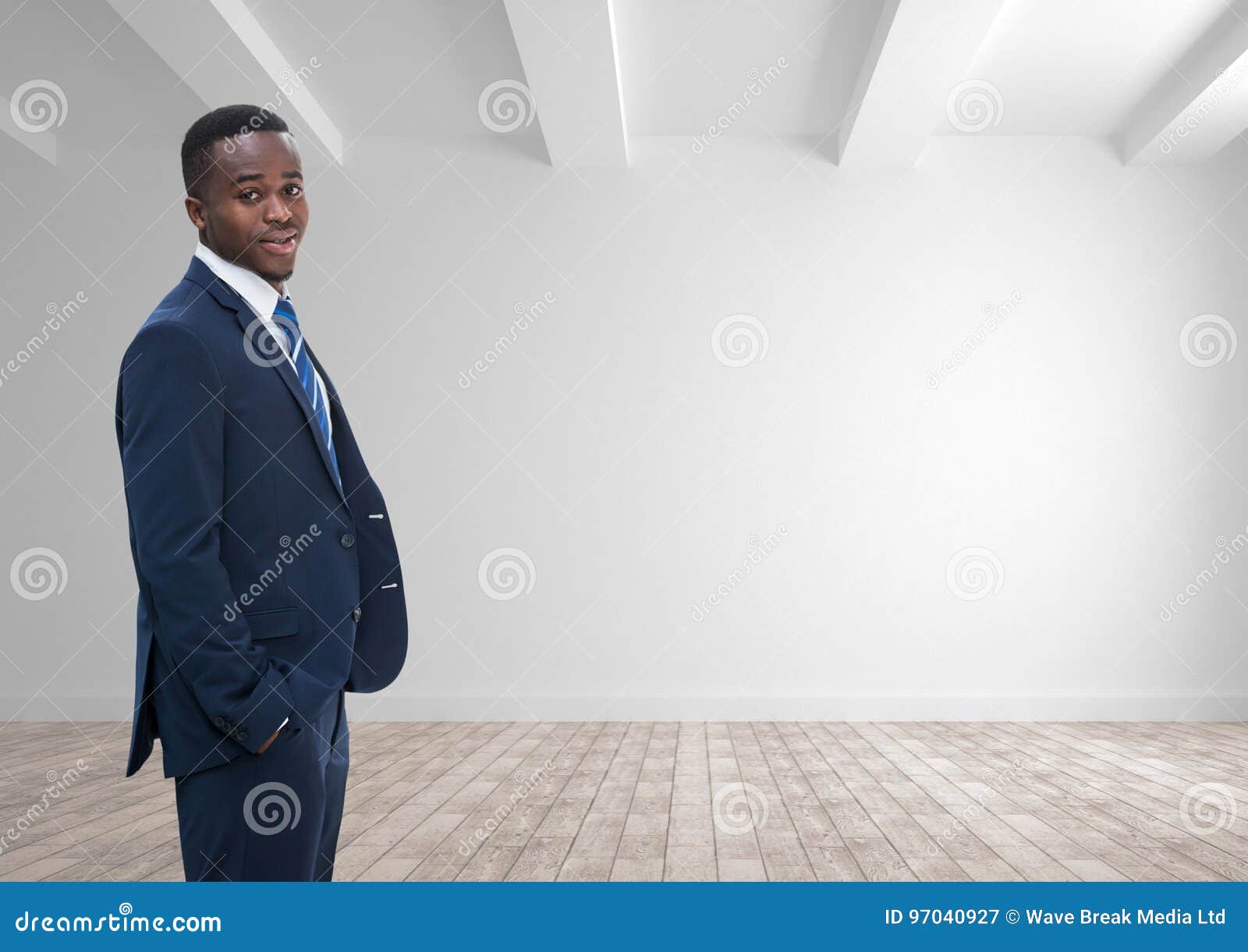 Business Man Standing Against White Wall Background Stock Image - Image ...
