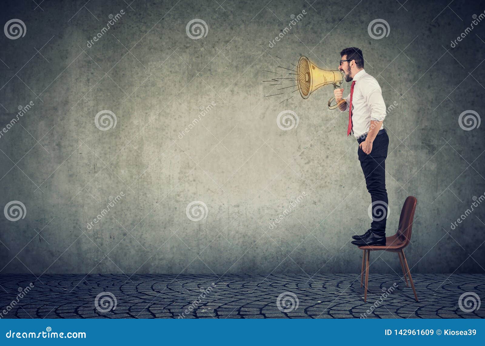 Business Man Standing on a Chair and Screaming into a Megaphone Stock ...