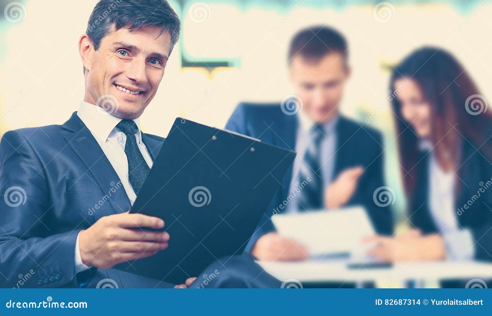 Business Man Standing with His Staff in Background at Office Stock ...