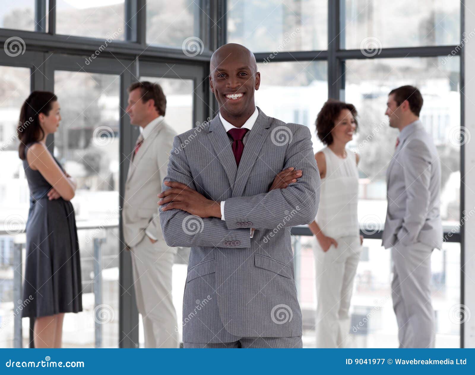 A Business Man Standing Smiling with Team Stock Image - Image of ...