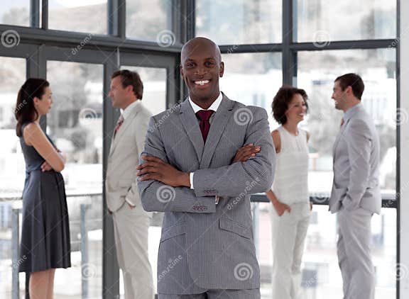 A Business Man Standing Smiling with Team Stock Image - Image of ...