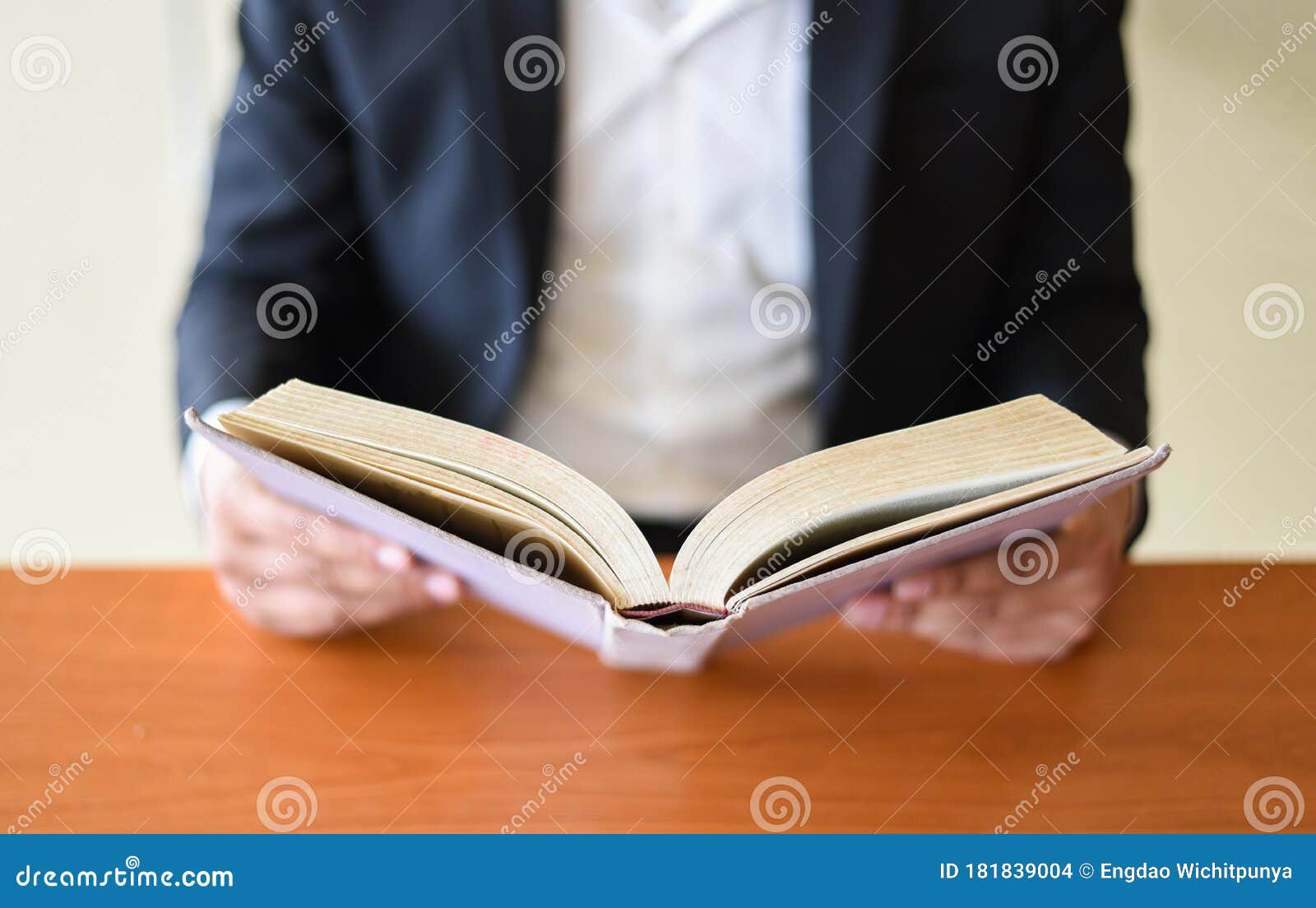 Business Man or Student Holding a Book on Hand - Business Education ...
