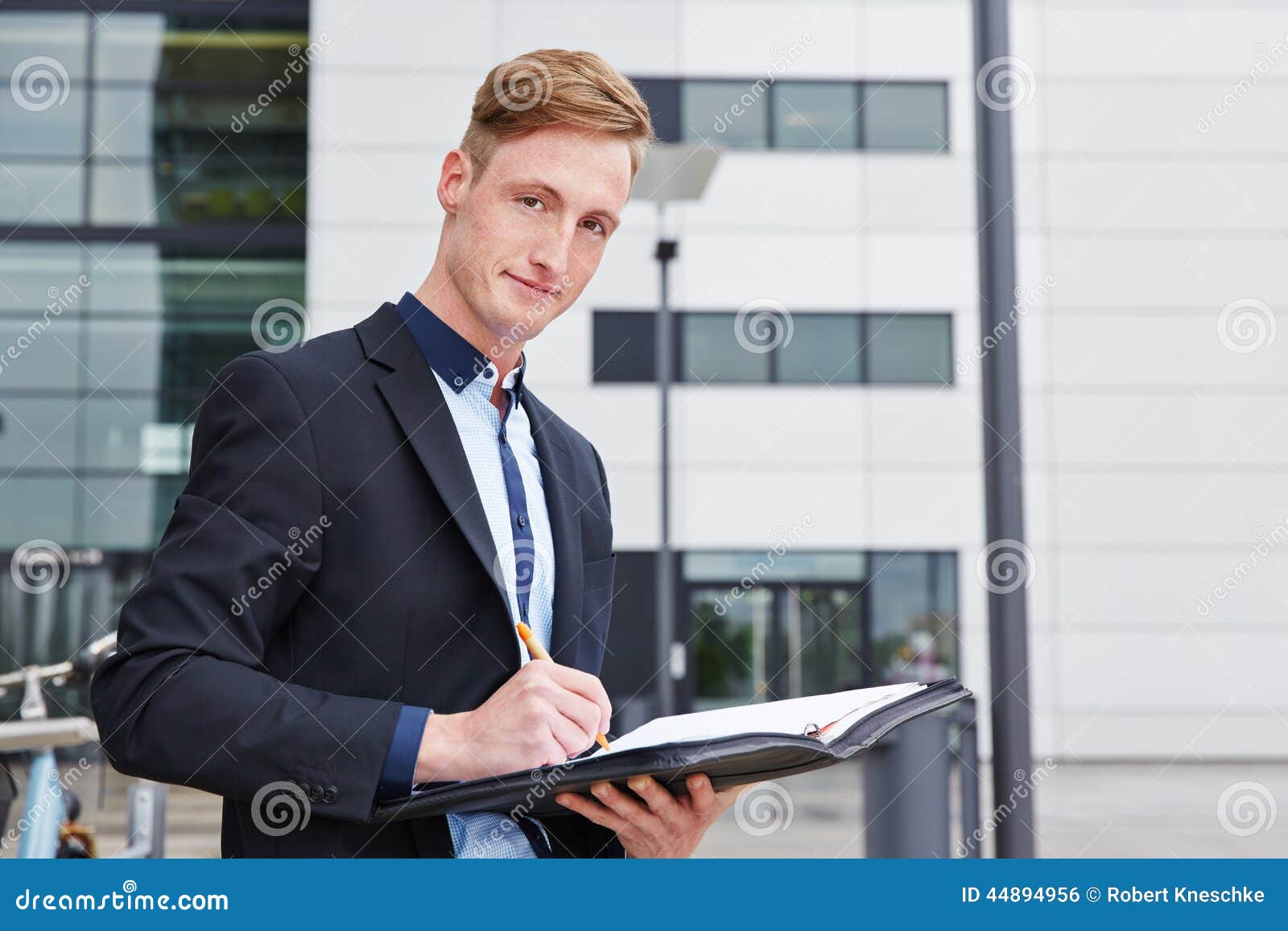 Business Man Taking Notes in Files Stock Photo - Image of scheduling ...