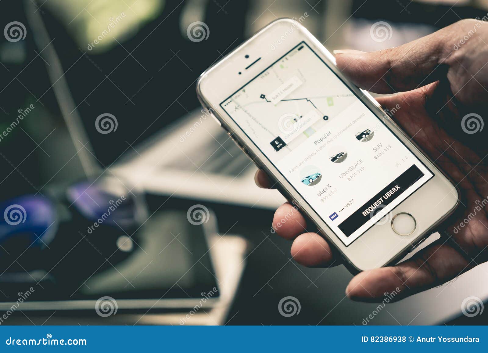 Business Man is Using Uber Application on His IPhone. Editorial Stock ...