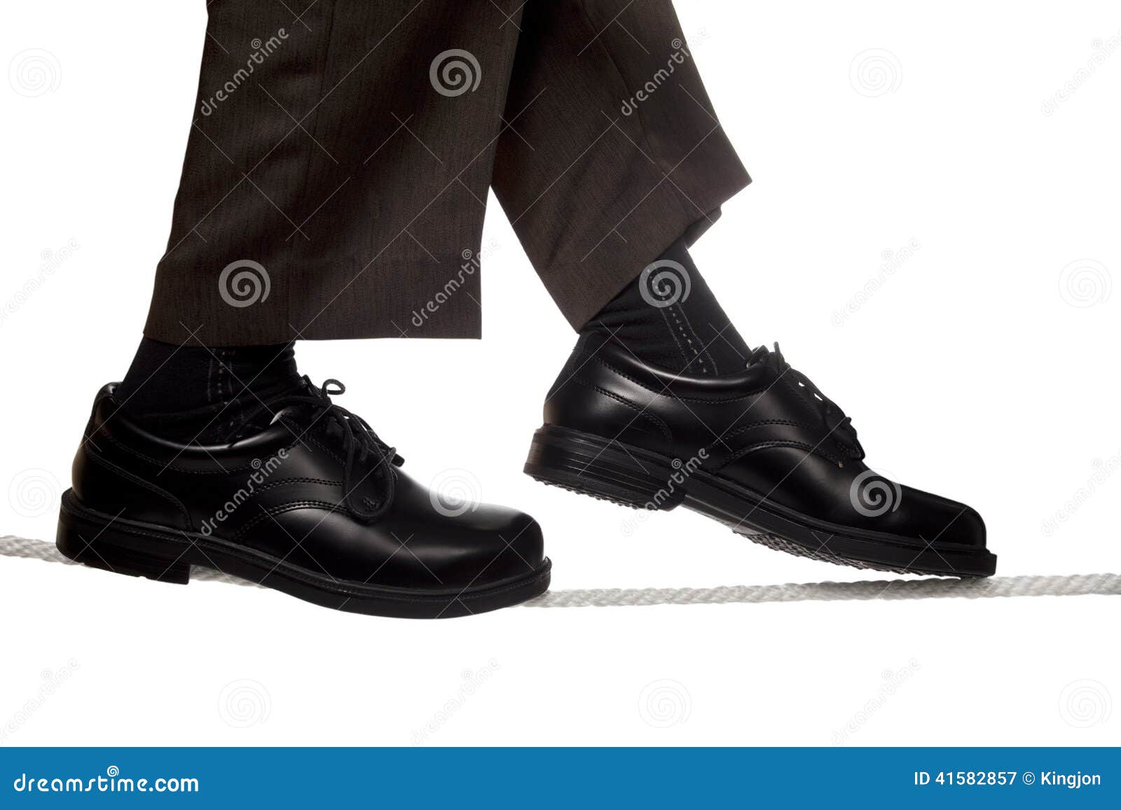 Business Man Walking a Tight Rope Stock Image - Image of suit ...