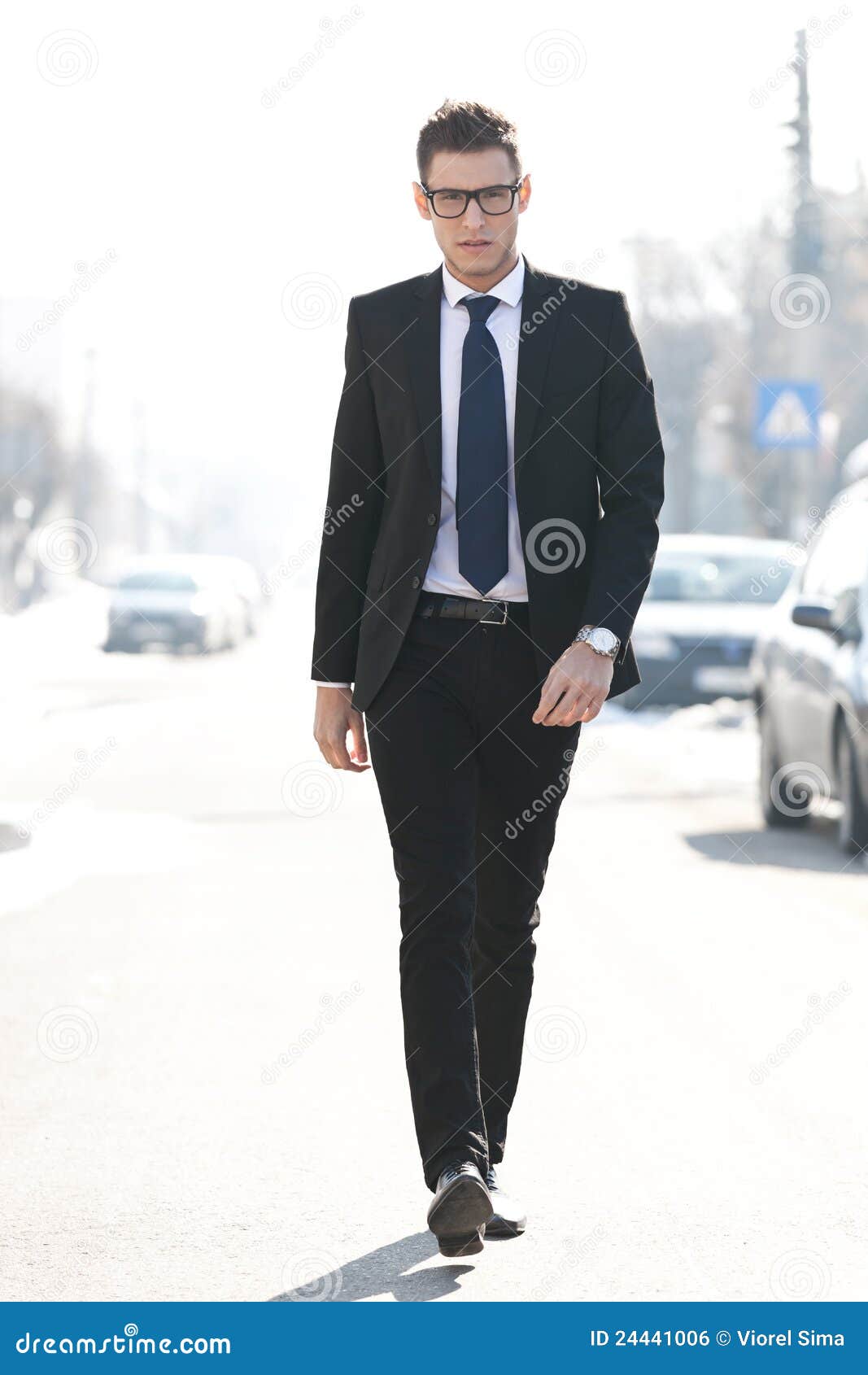 Business Man Walking Towards the Camera Stock Photo - Image of serious ...
