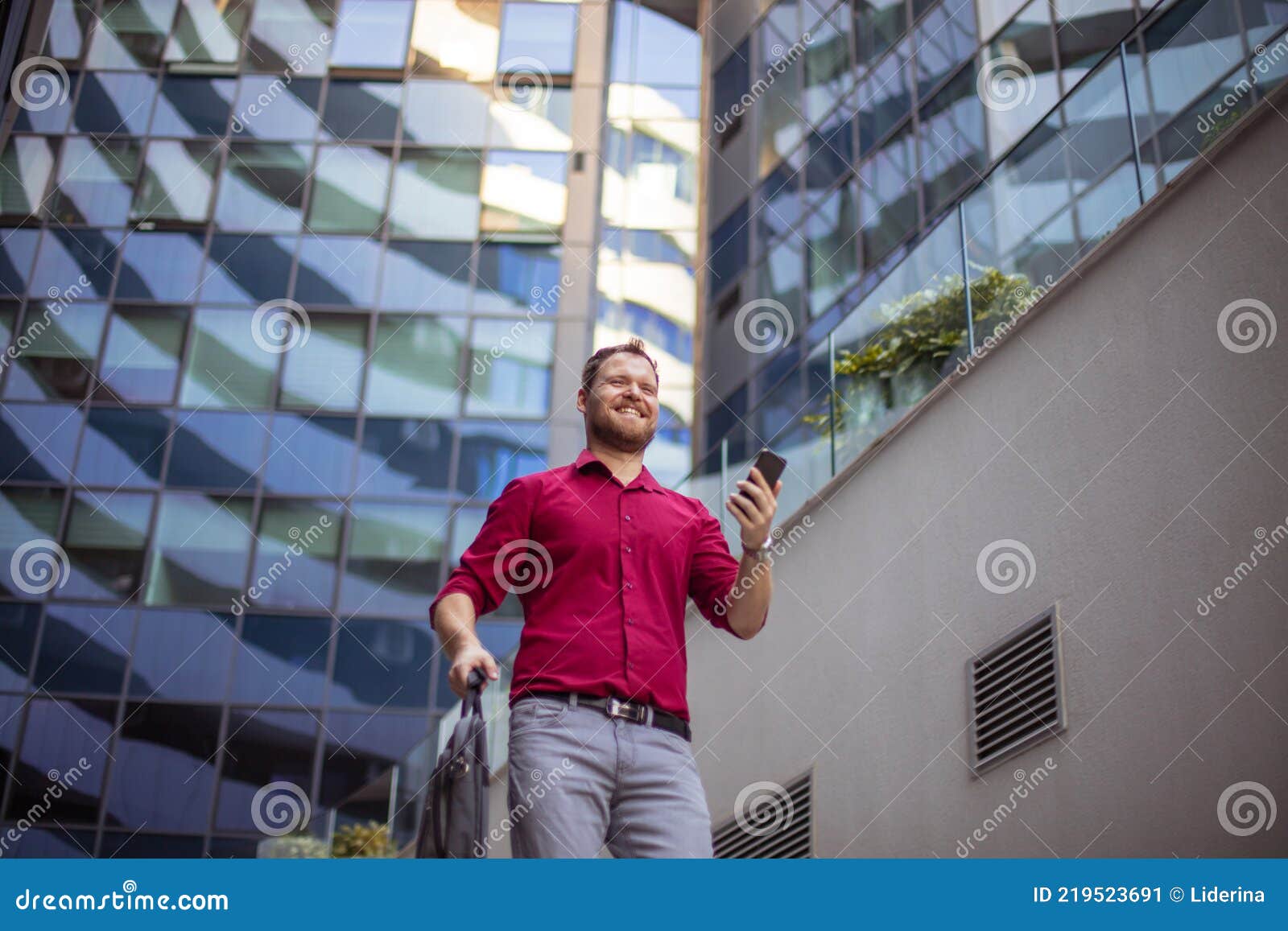 Man Walking and Using Mobile Stock Image - Image of cheerful, walking ...