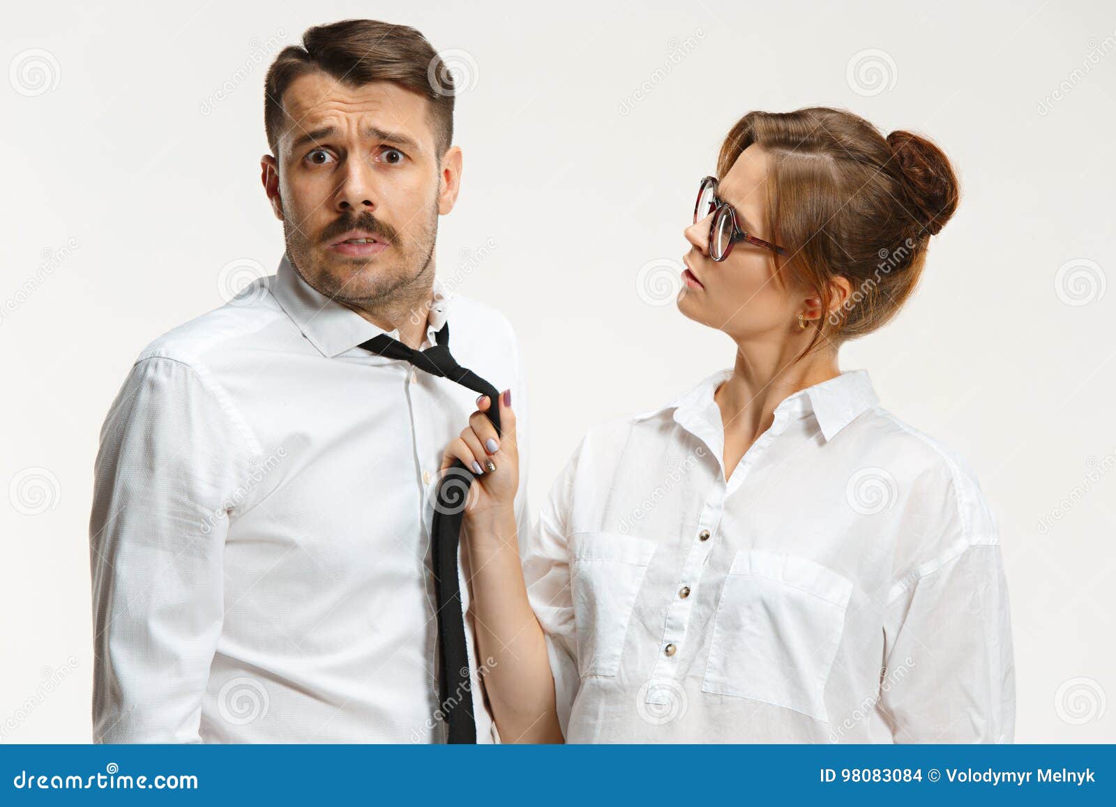 The Business Man And Woman Communicating On A Gray Background Stock
