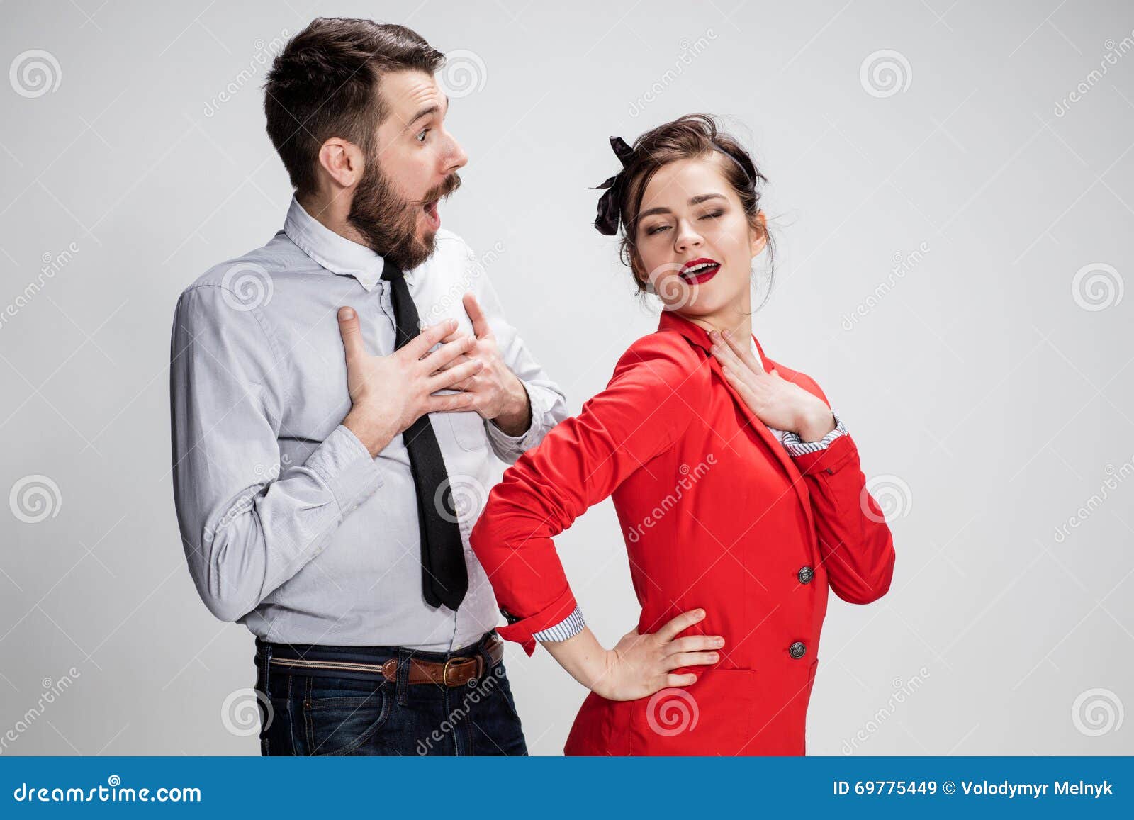 The Business Man And Woman Communicating On A Gray Background Stock