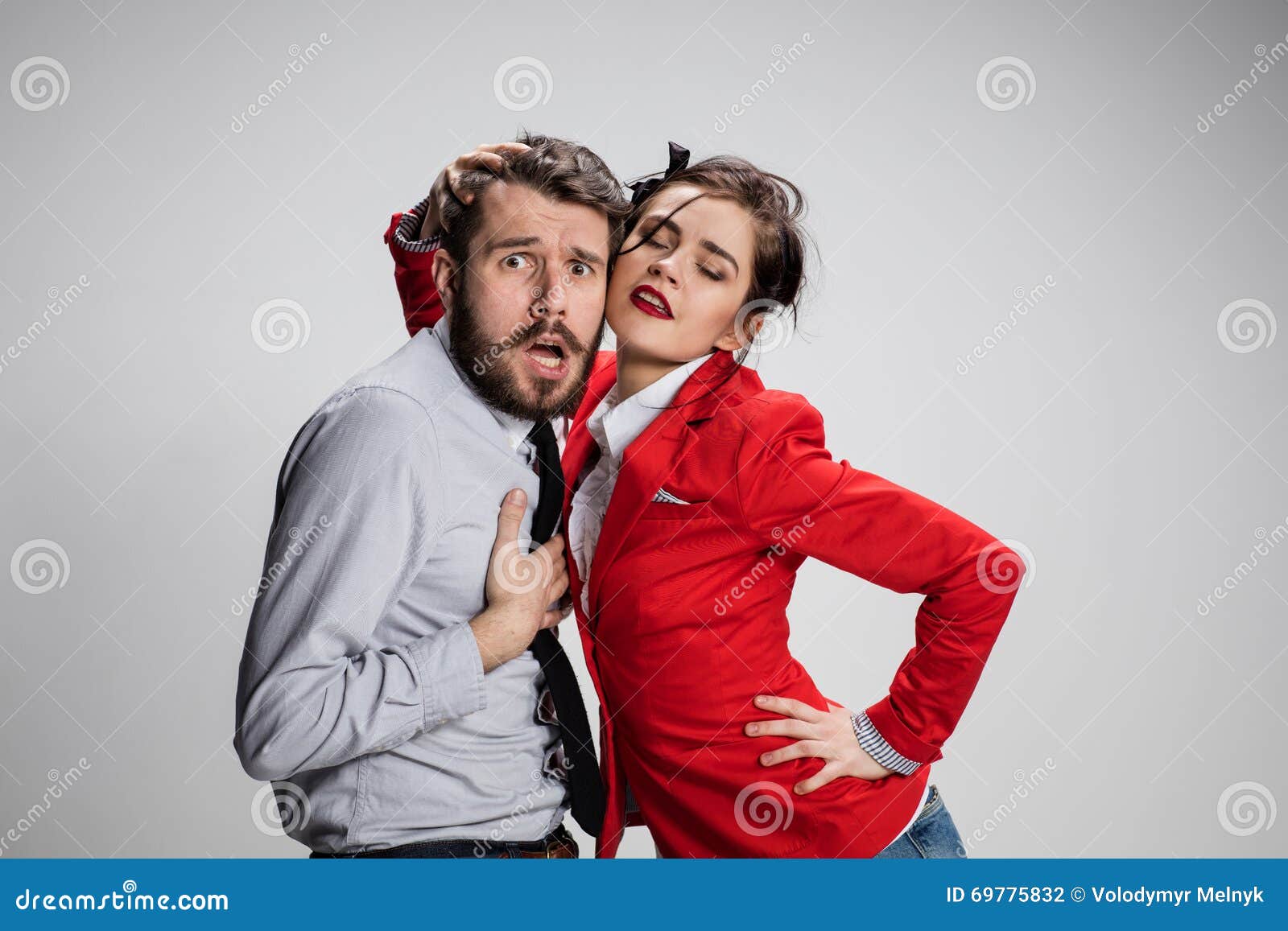 The Business Man And Woman Communicating On A Gray Background Stock