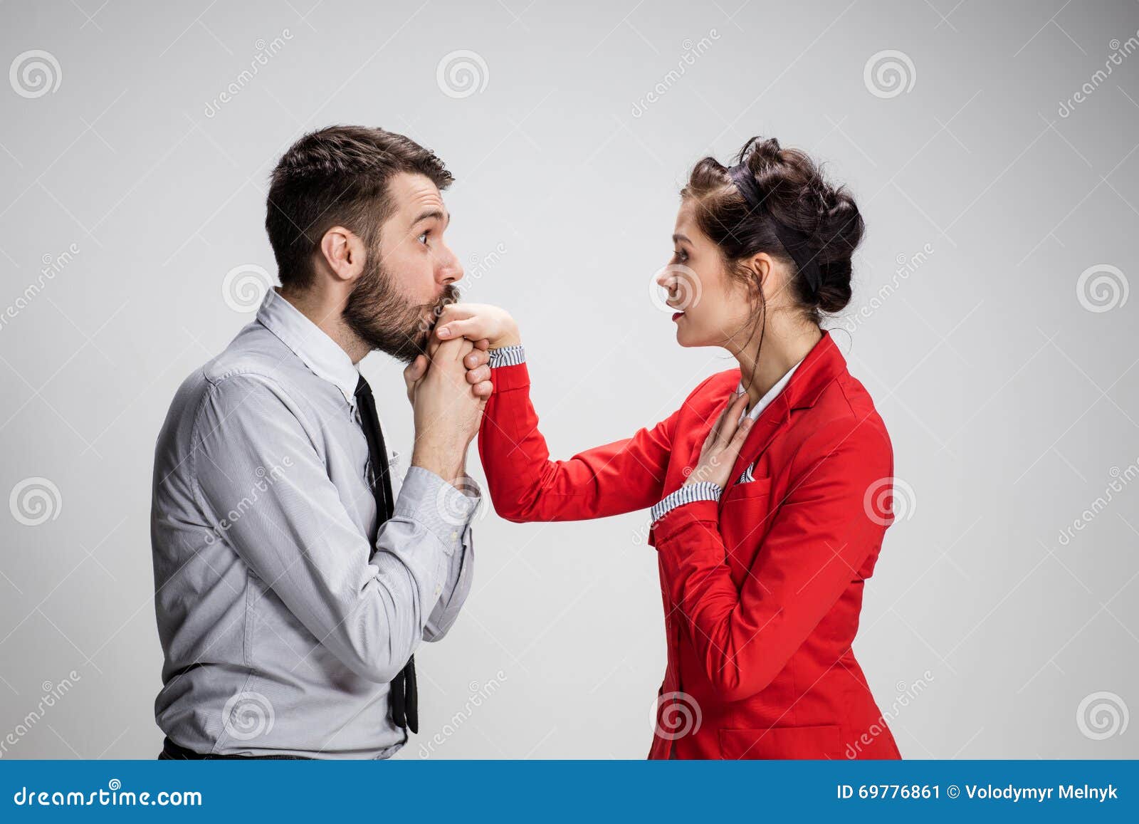 The Business Man And Woman Communicating On A Gray Background Stock