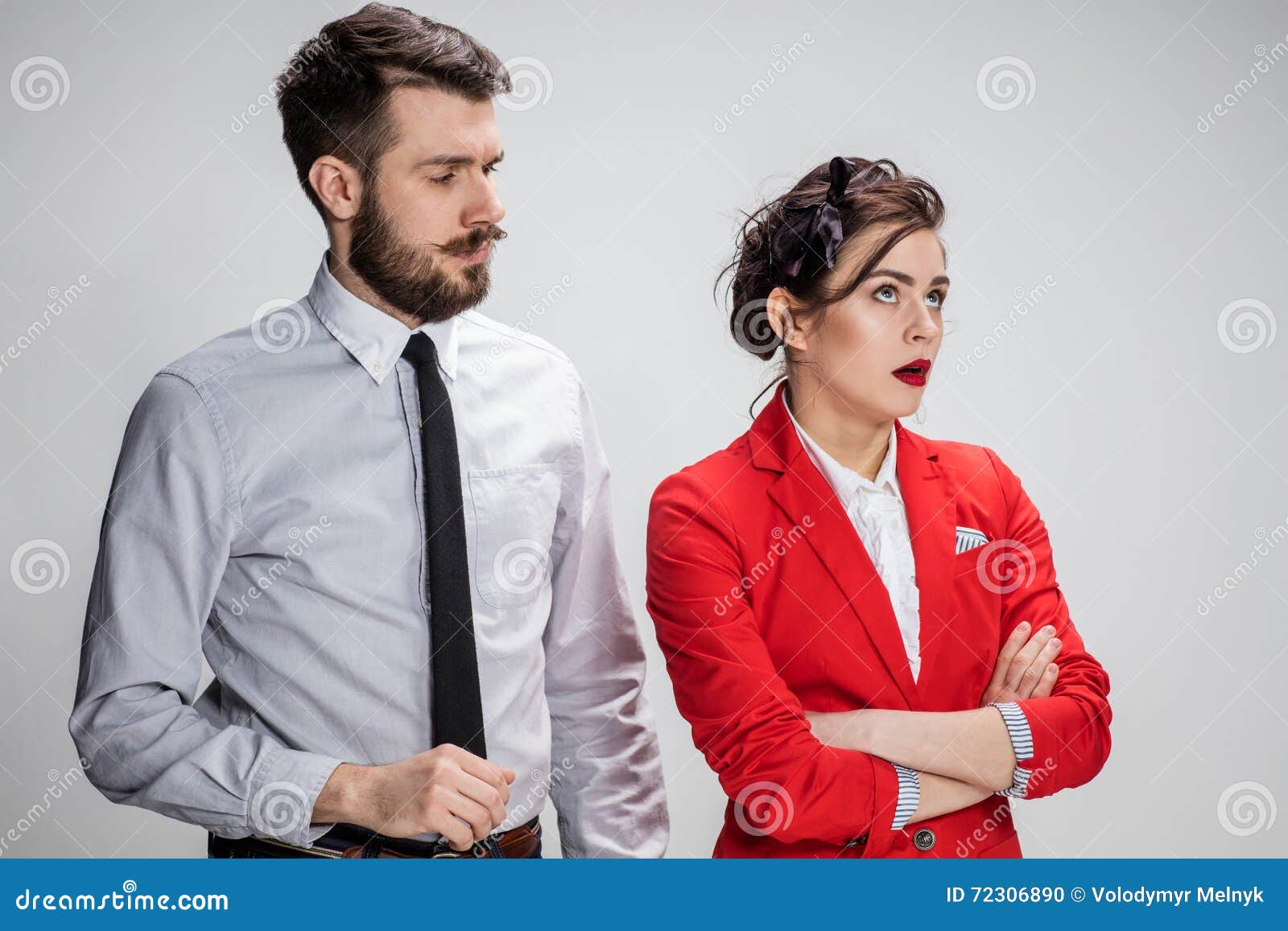 The Business Man And Woman Communicating On A Gray Background Stock
