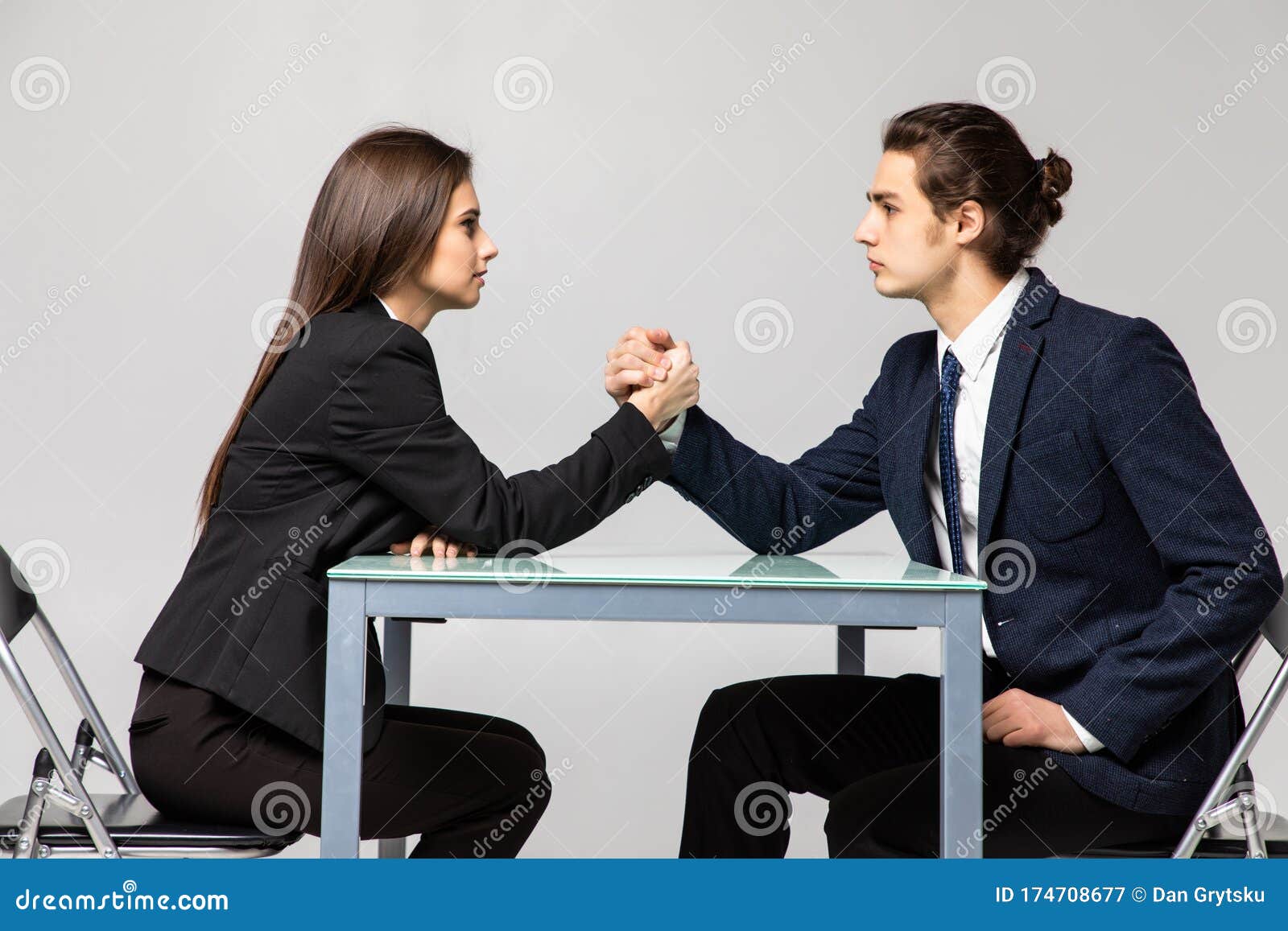 Arm Wrestling Between Male Hand And Female Hand With Different Skin