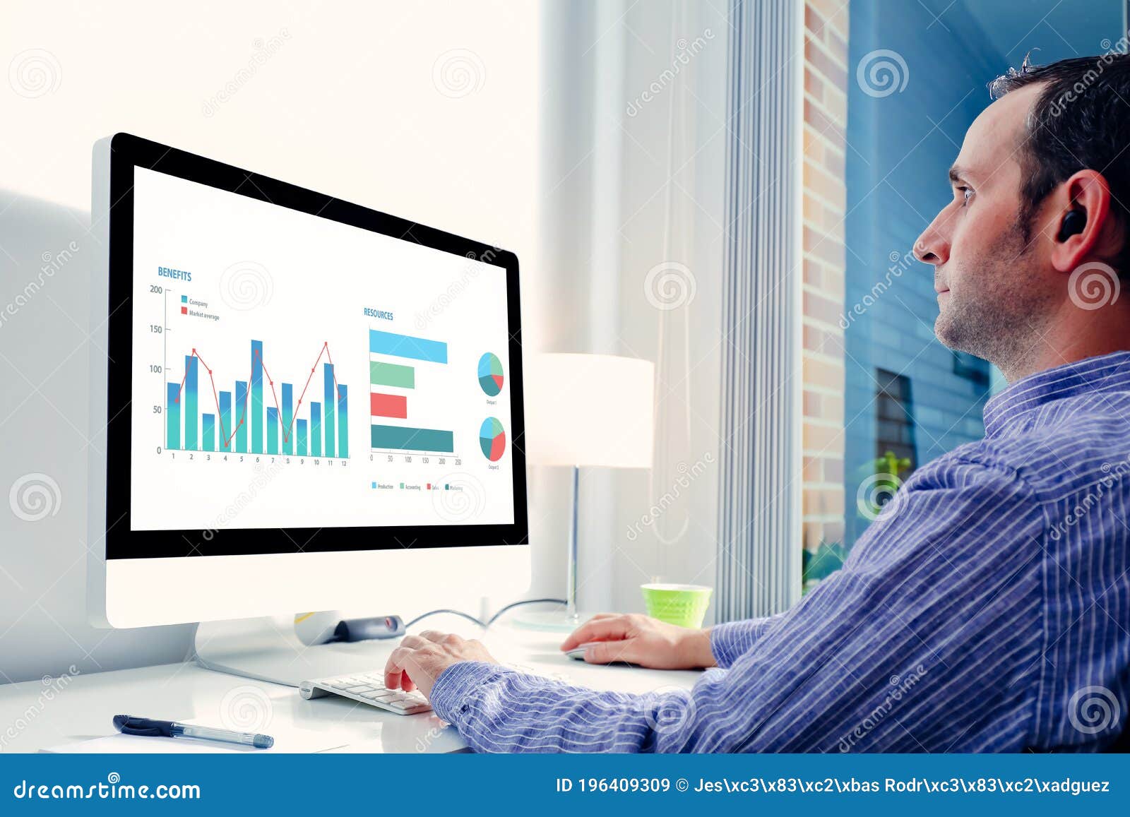 Business Man Working on Computer with Business Graphics on the Screen ...