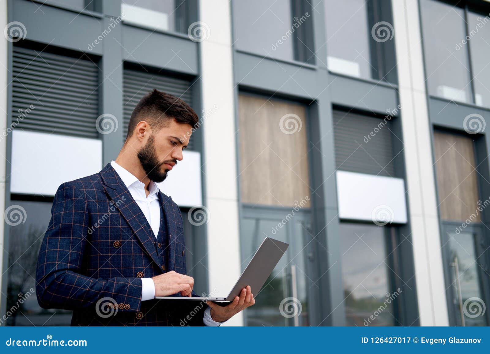 Business Man Working on Laptop Computer. Man in Business Suit on ...