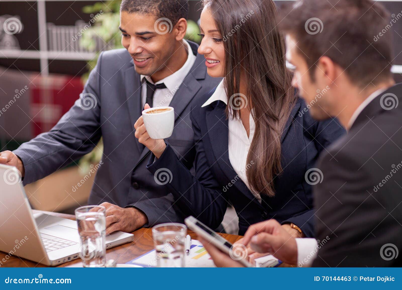 Business meeting in a cafe stock image. Image of meeting - 70144463