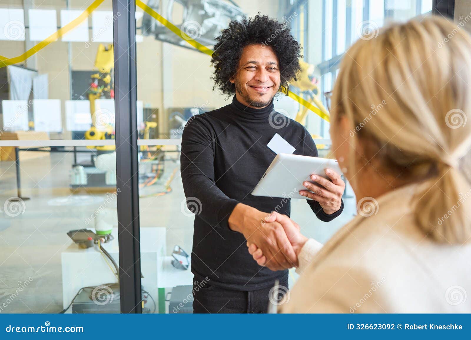 Business Meeting Handshake in a Robotics Lab with a Smile Stock Photo ... Business Meeting Handshake in a Robotics Lab with a Smile Stock Photo ...