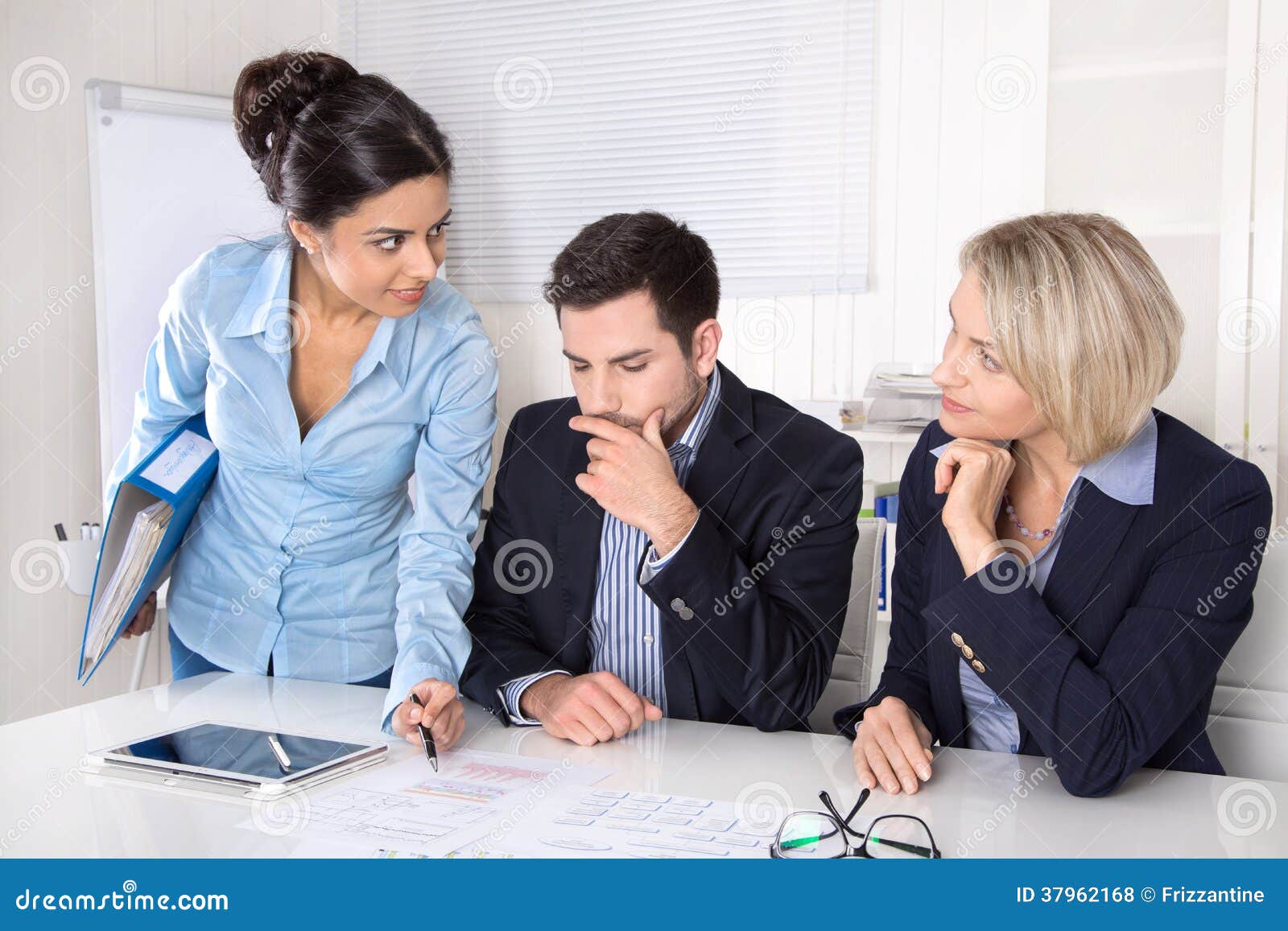 Business Meeting at Office with Three Business People. Stock Photo ...