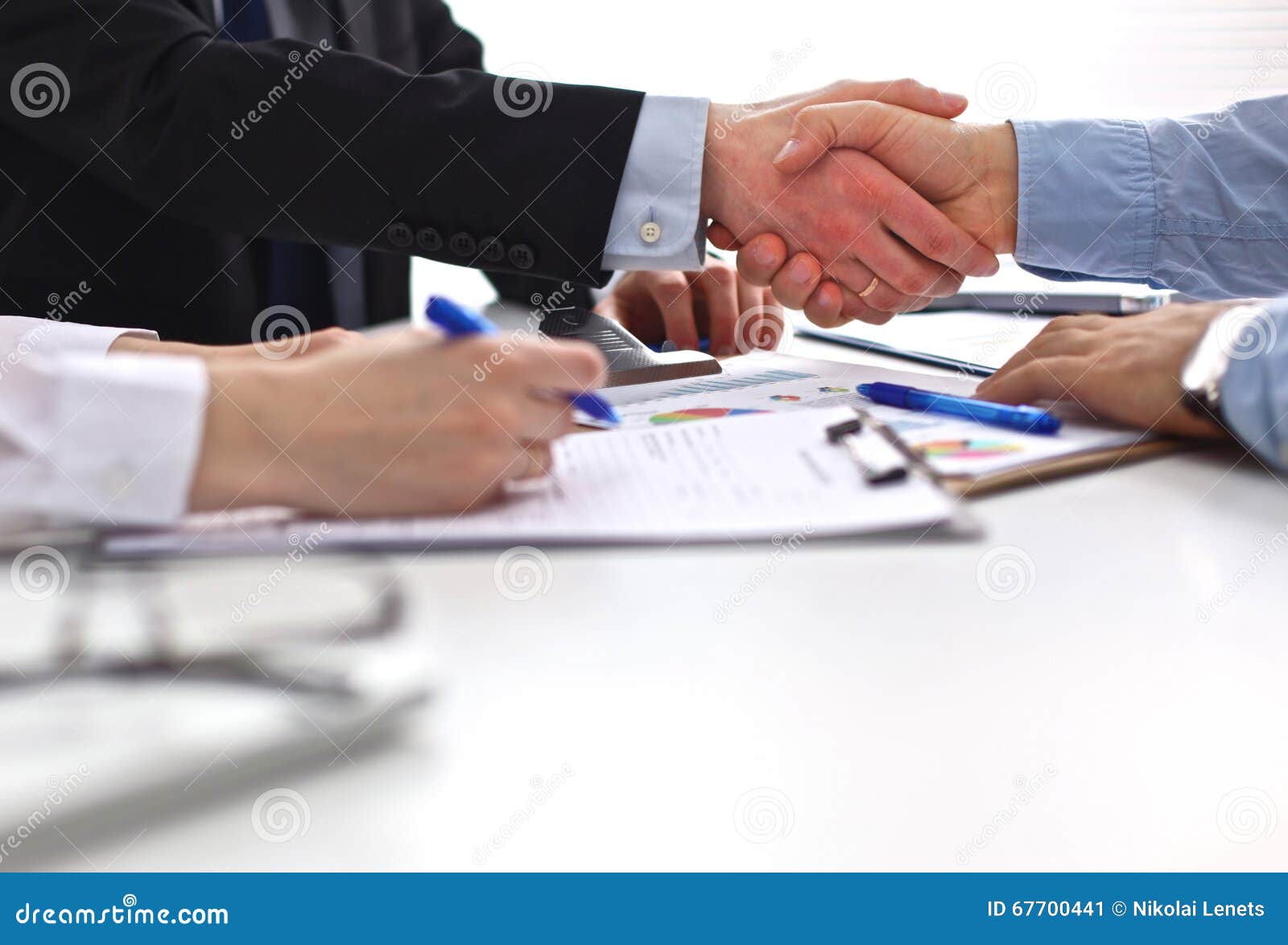 Business Meeting at the Table Shaking Hands Conclusion of the Contract ...