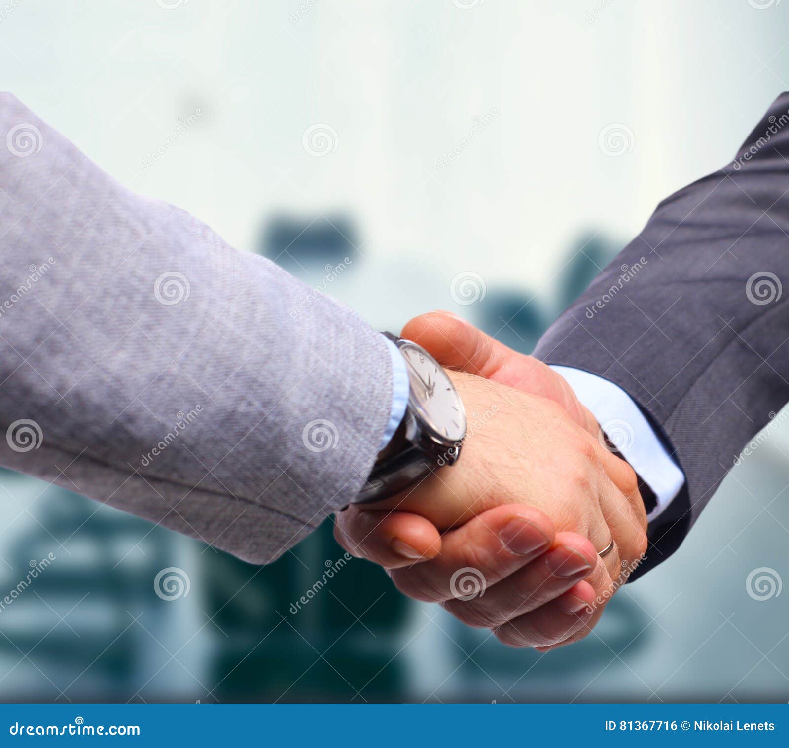 Business Meeting at the Table Shaking Hands Conclusion of the Contract ...