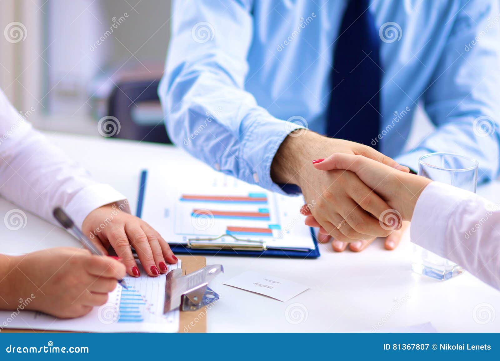 Business Meeting at the Table Shaking Hands Conclusion of the Contract ...