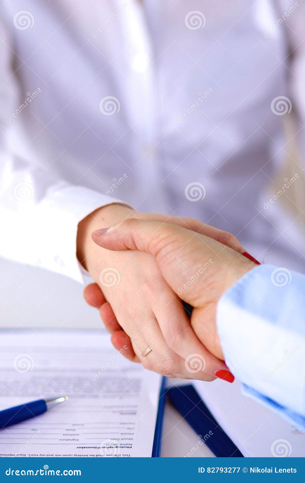 Business Meeting at the Table Shaking Hands Conclusion of the Contract ...