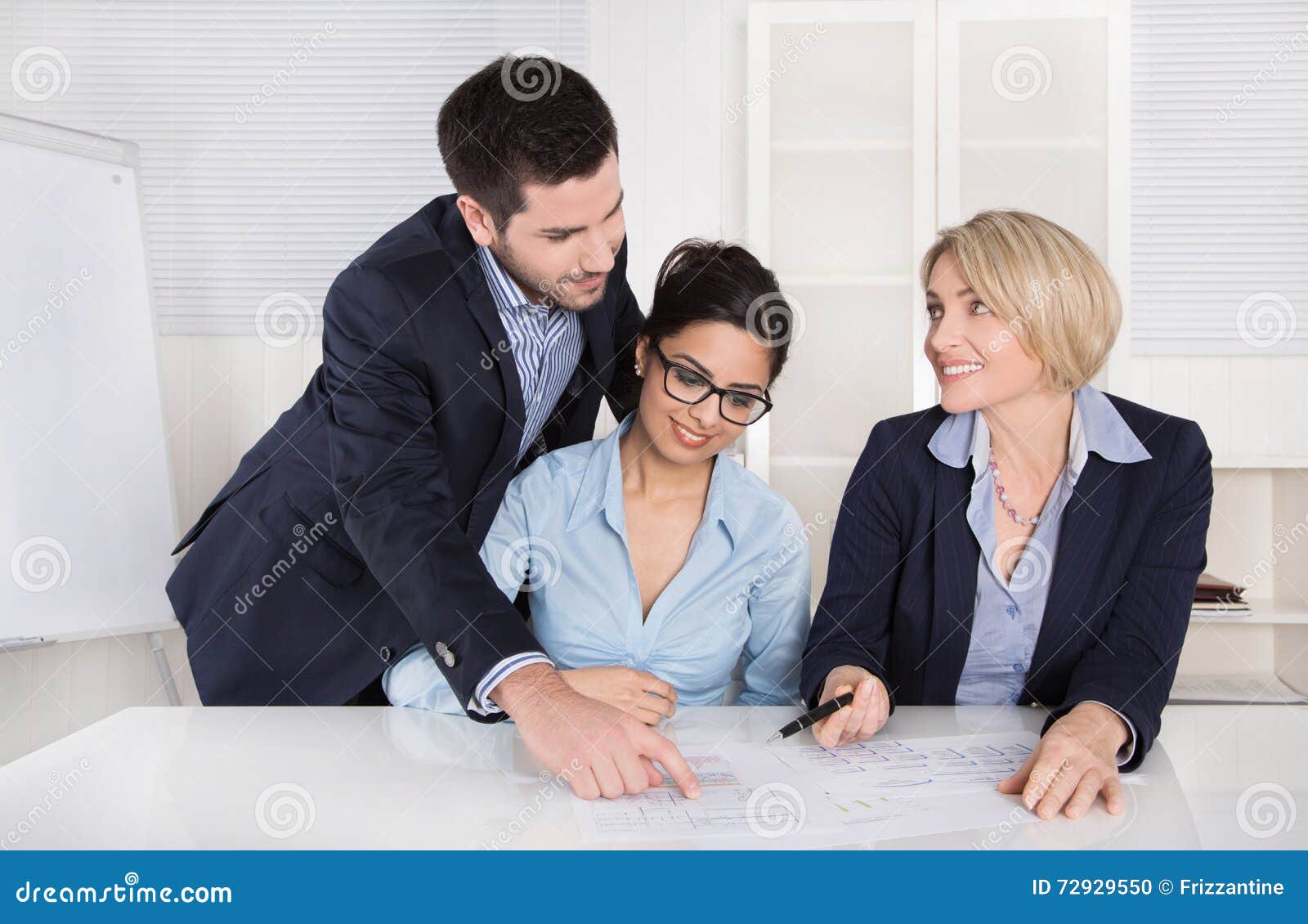 Business Meeting. Three People Sitting at the Table in an Office Stock ...