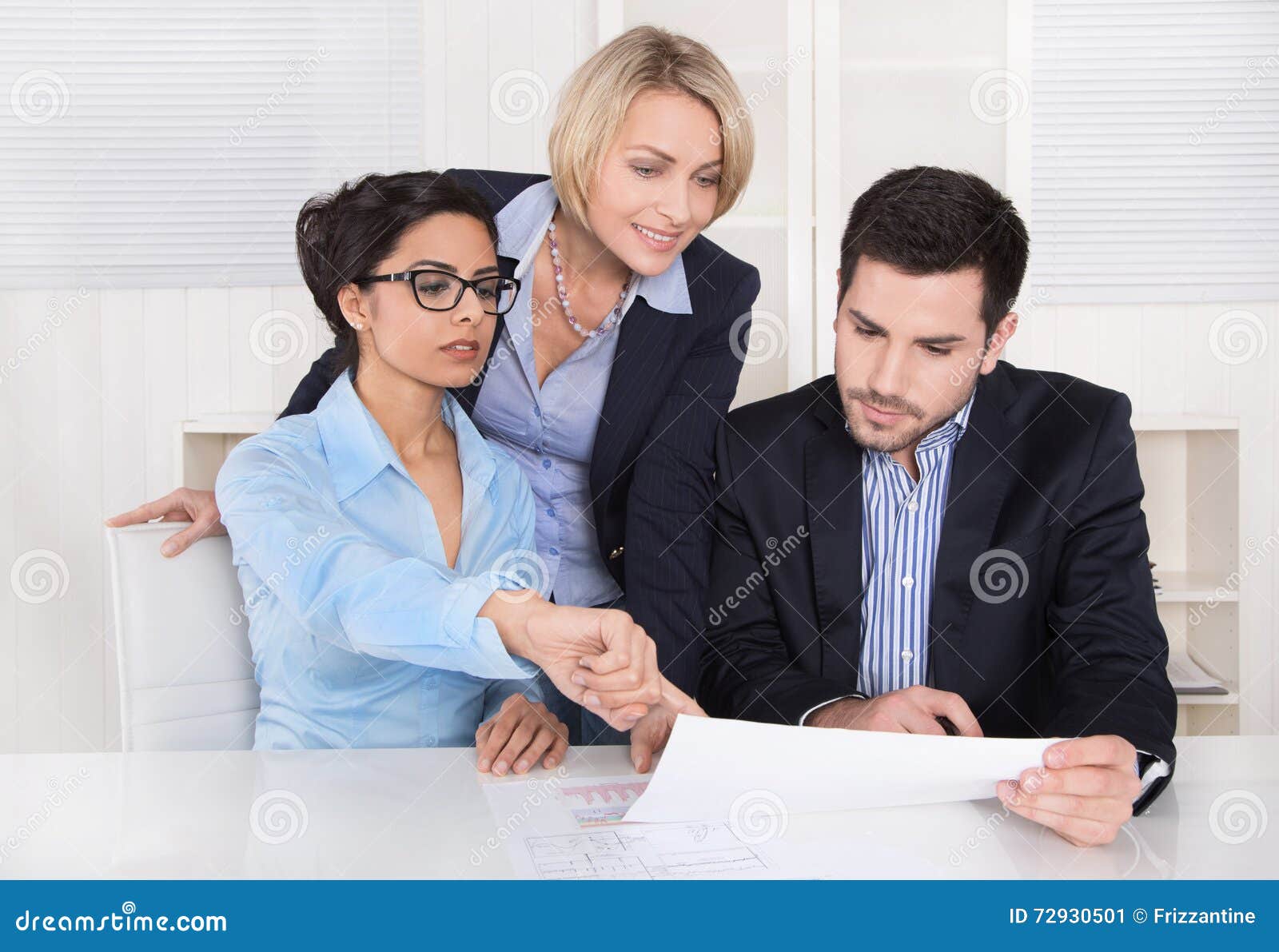 Business Meeting. Three People Sitting at the Table in an Office Stock ...