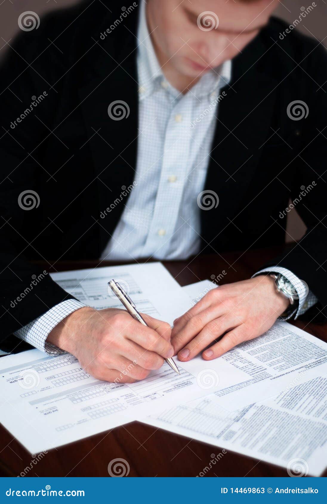 Business Men Filling Out Documents on a Desk. Stock Image - Image of ...