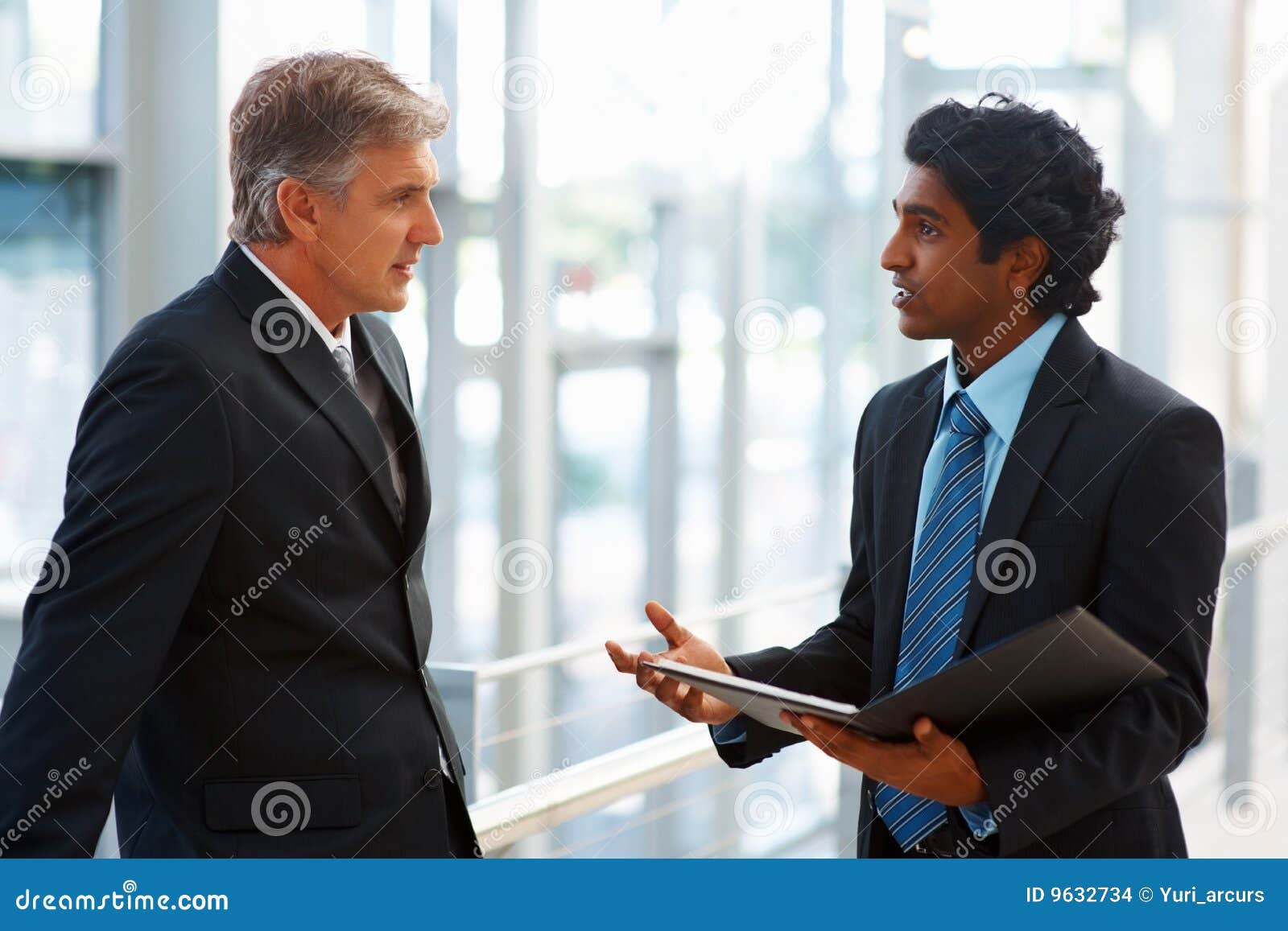 Business Men Having a Discussion on a Project File Stock Photo - Image ...