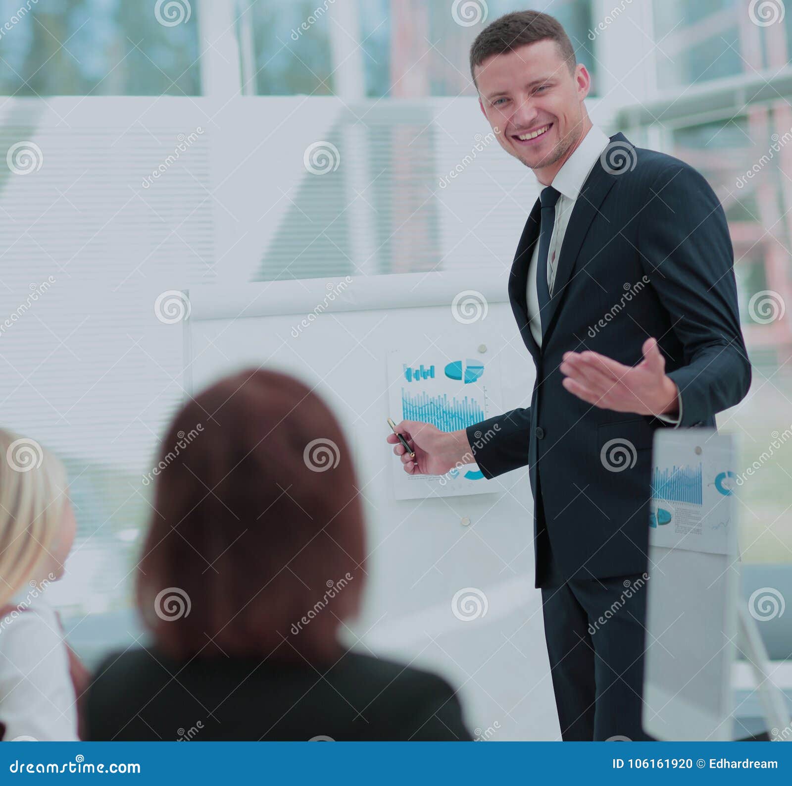 Attractive Man Making a Business Presentation To a Group Stock Photo ...