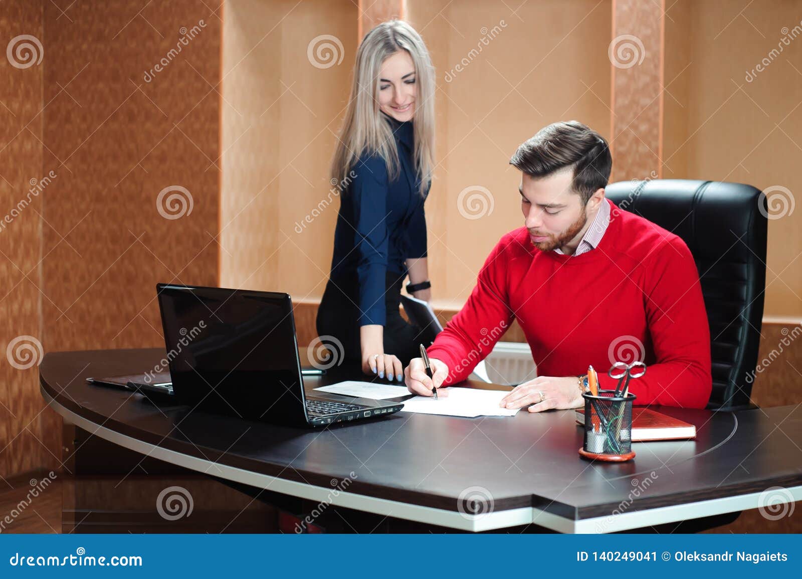 Business Partner Sitting at the Table in Front of a Compute. Stock ...