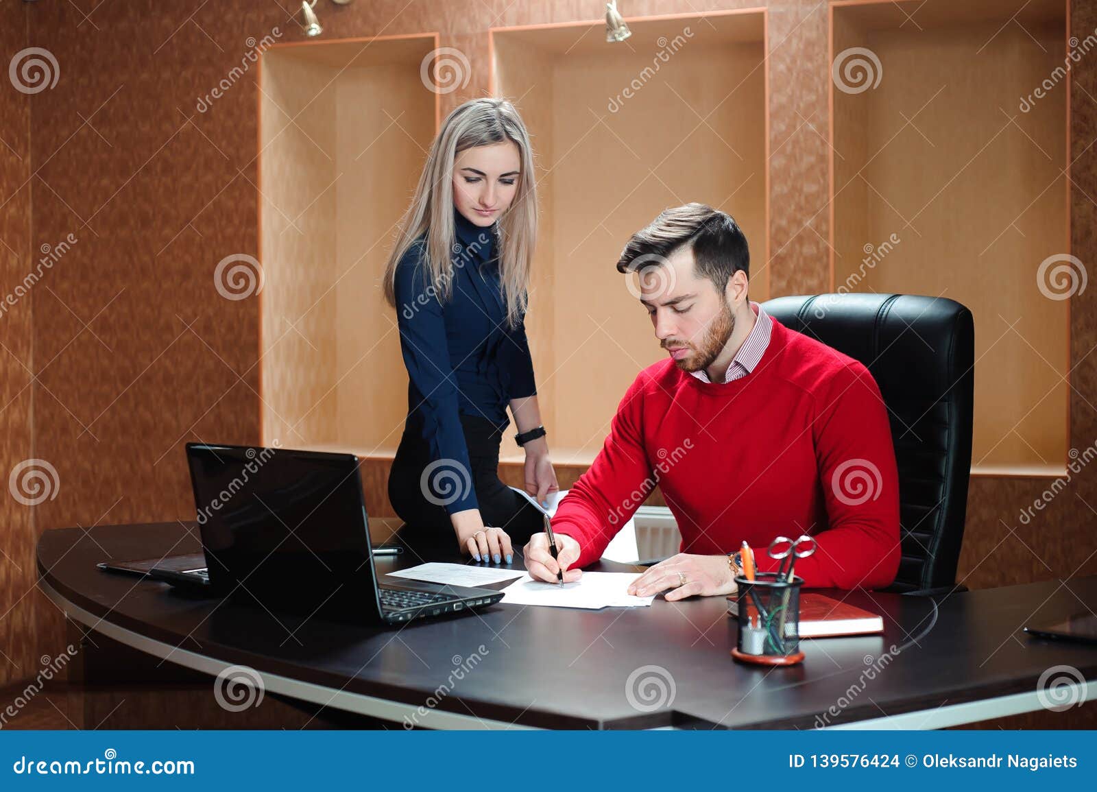 Business Partner Sitting at the Table in Front of a Compute. Stock ...