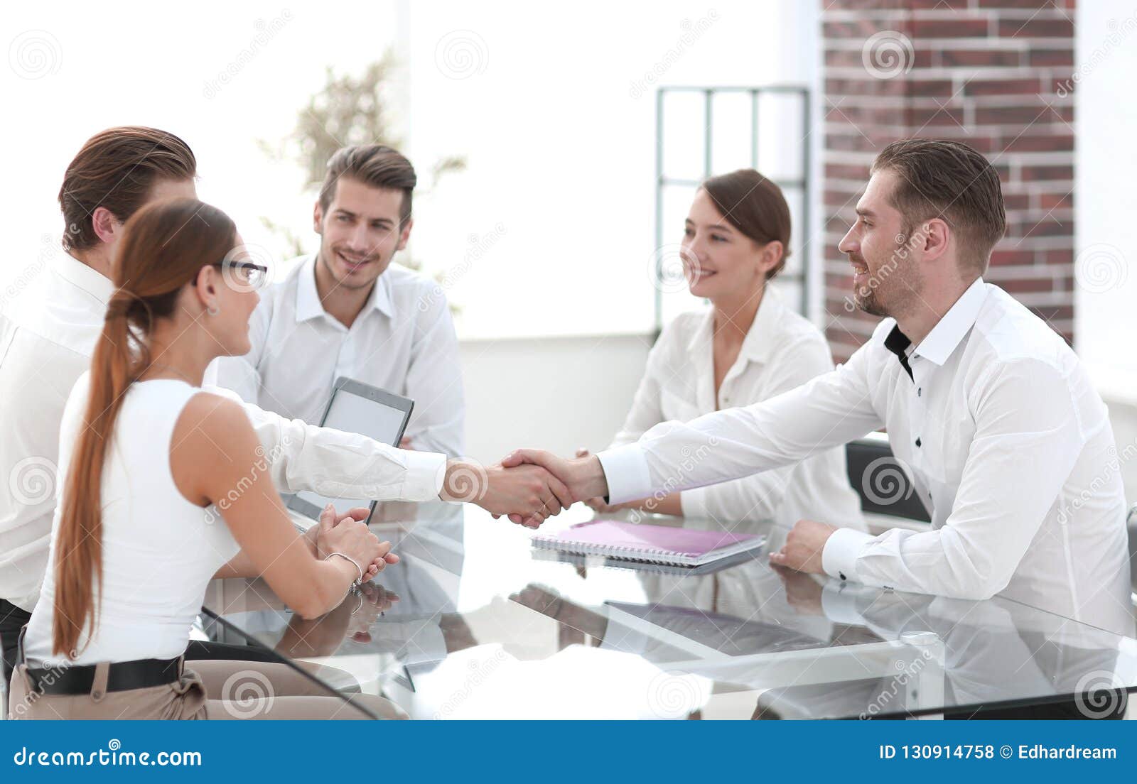 Business Partners, Confirming the Transaction by Handshake Stock Photo ...