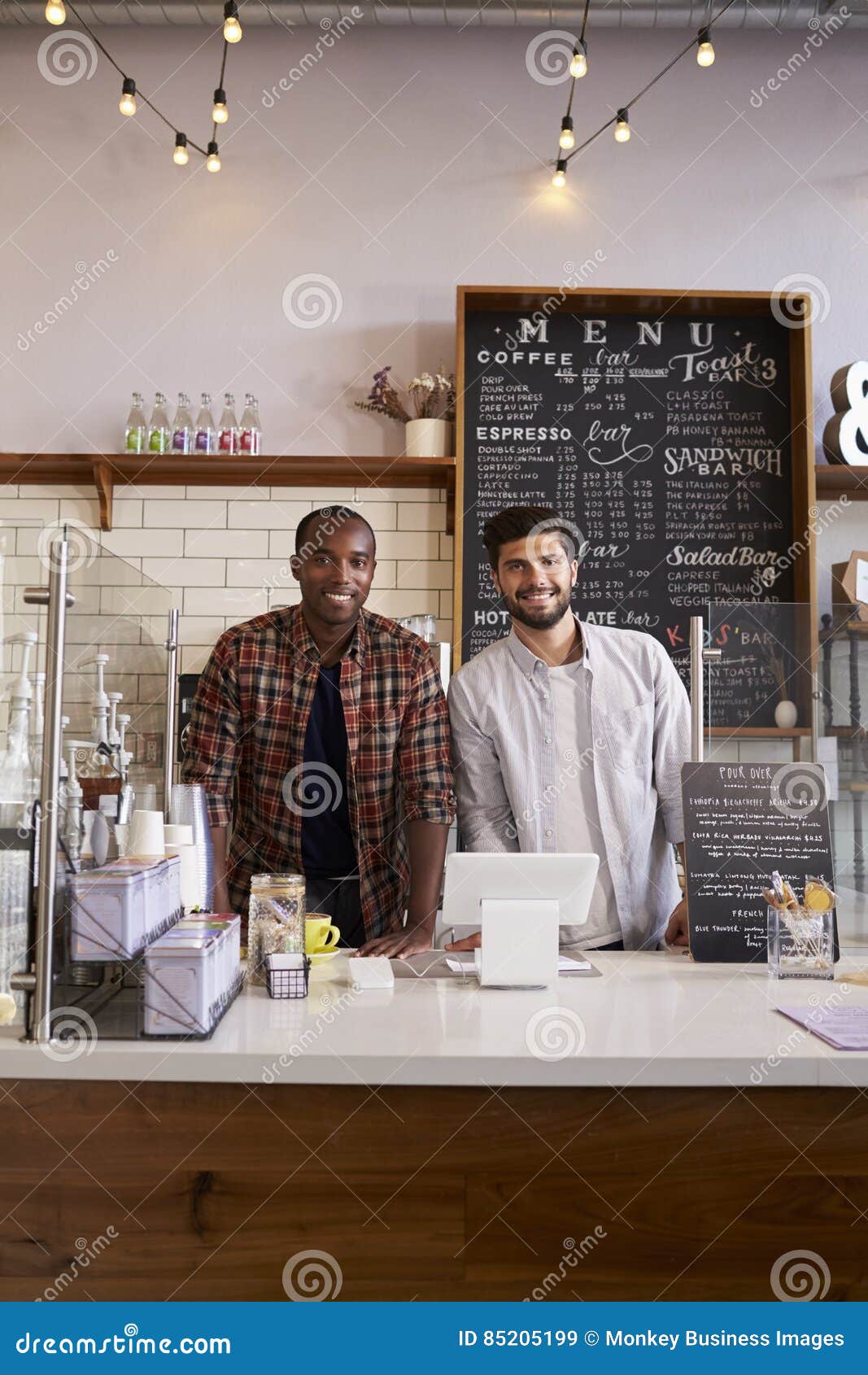 Business Partners at the Counter of a Coffee Shop, Vertical Stock Image ...